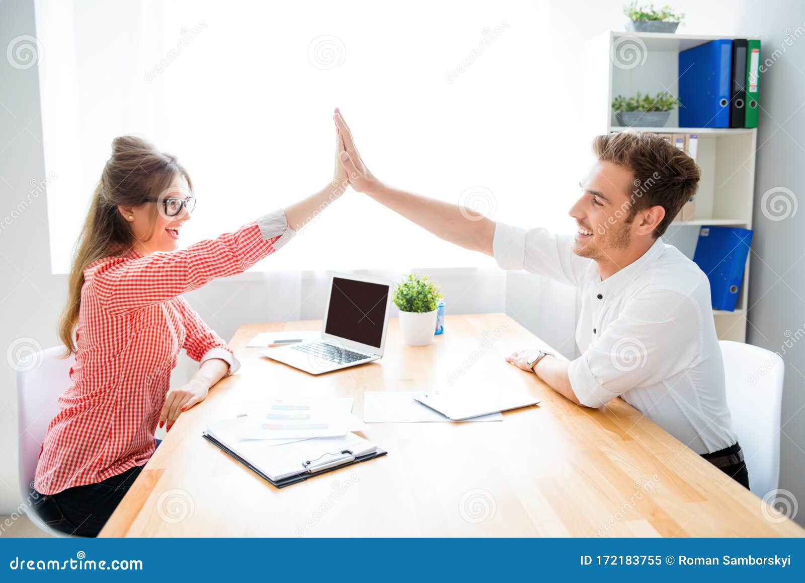 Two Colleagues Compliting Task and Giving High Five Stock Image - Image ...