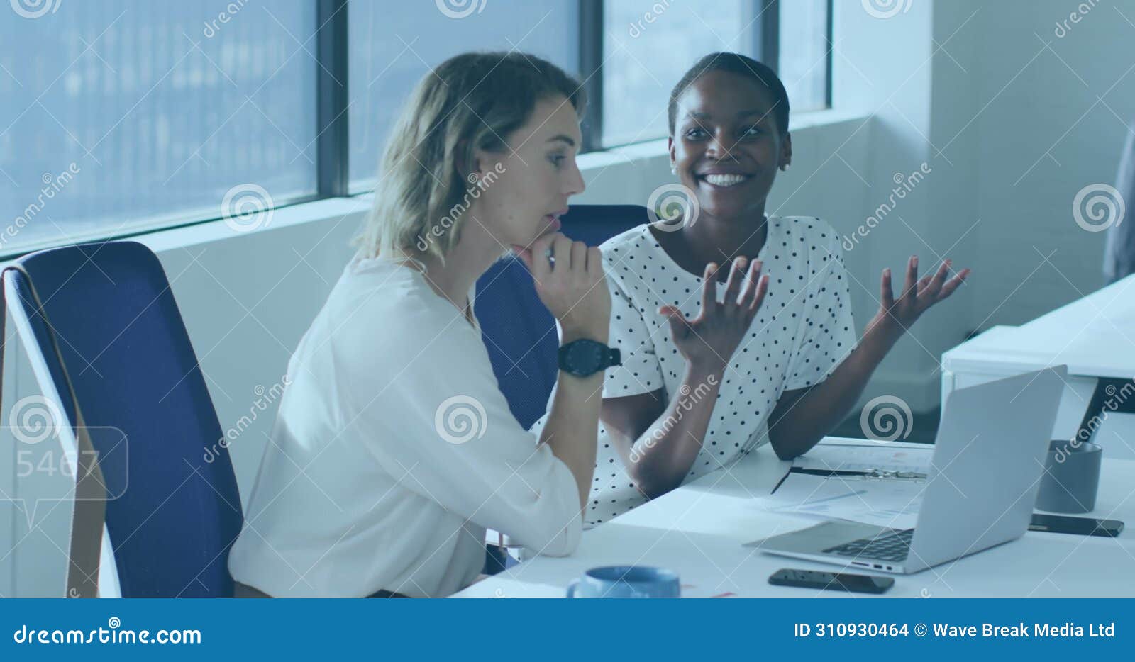 Two Colleagues Discuss Their Work on a Laptop Stock Photo - Image of ...