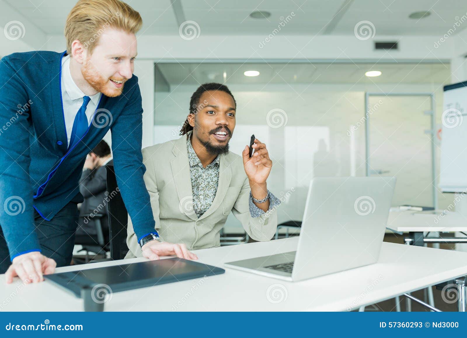 Two Colleagues Discussing Graphics Design Flaws in a Nice White Stock ...