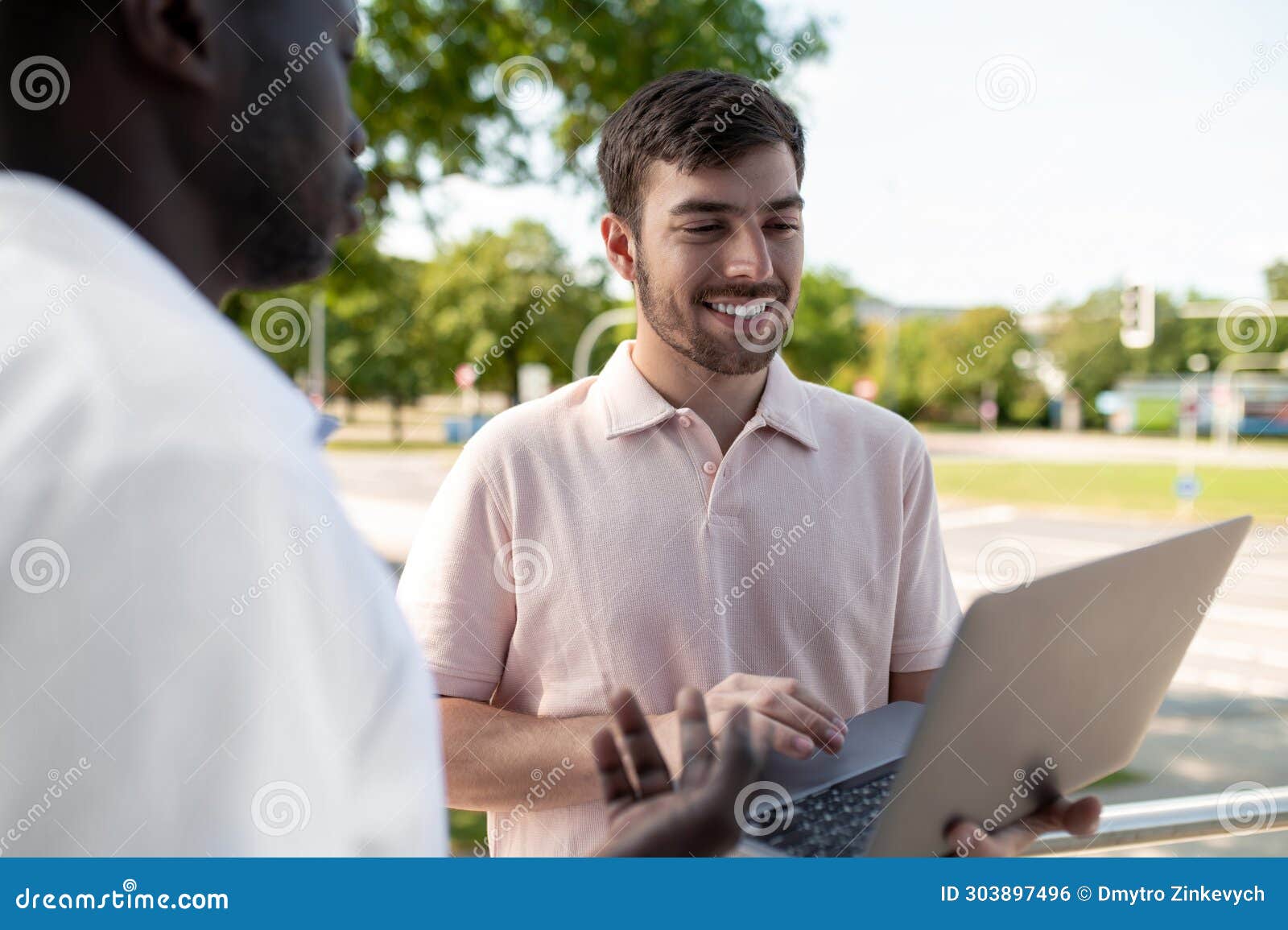 Two Colleagues Discussing Project Details and Looking Interested Stock ...