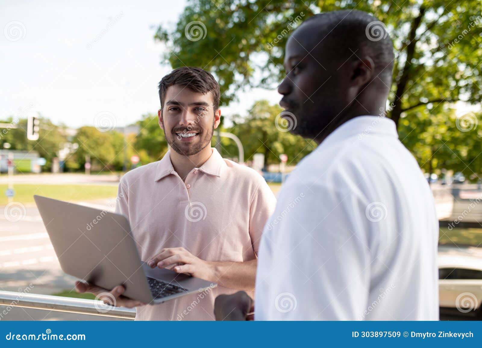 Two Colleagues Discussing Project Details and Looking Interested Stock ...
