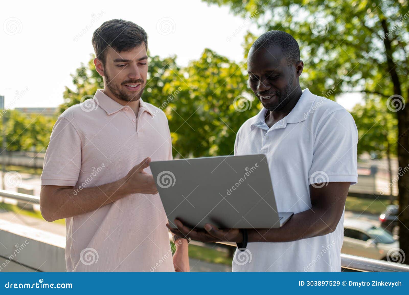 Two Colleagues Discussing Project Details and Looking Interested Stock ...