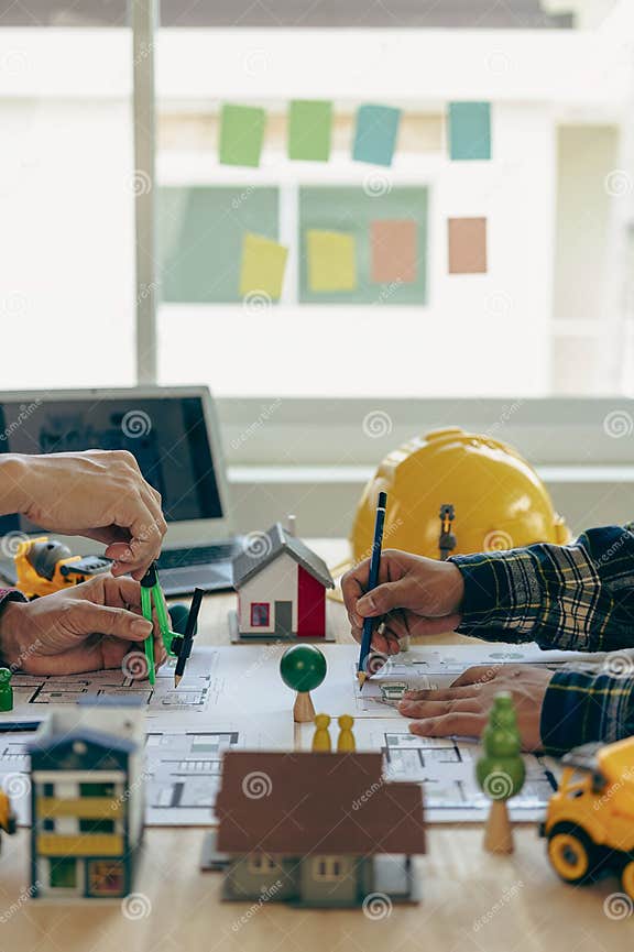 Two Colleagues are Discussing Using Data and Laptops about an ...