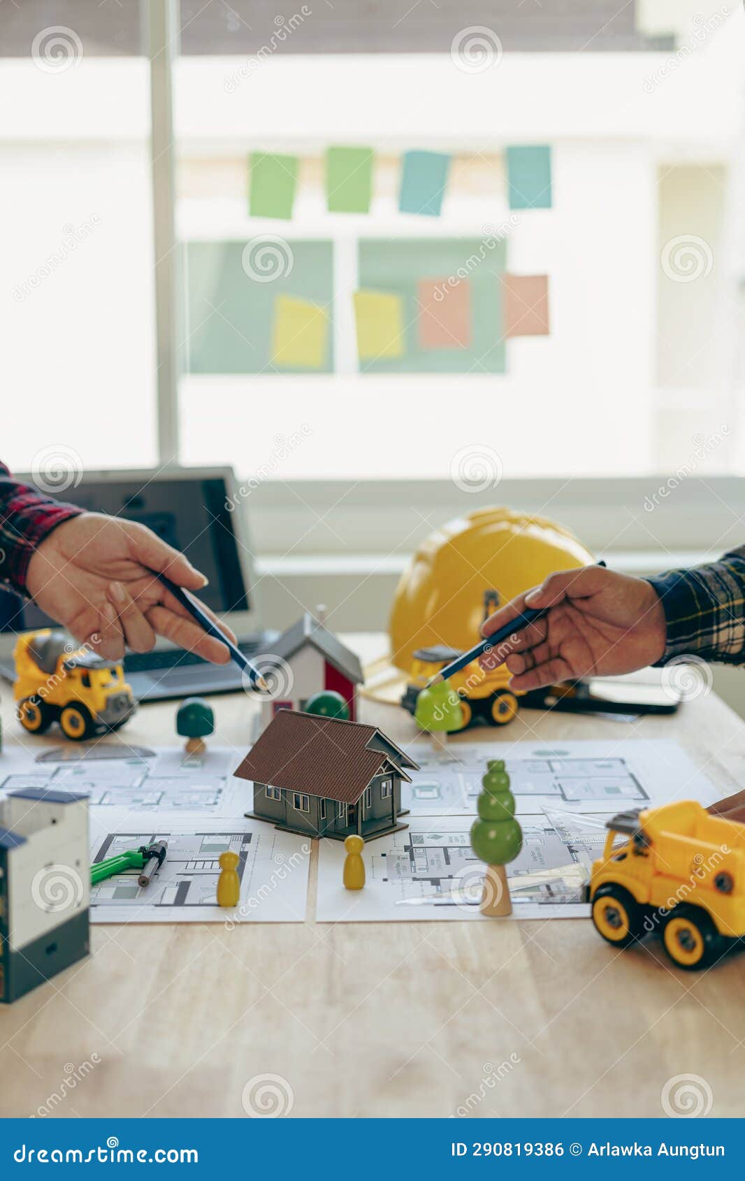 Two Colleagues are Discussing Using Data and Laptops about an ...