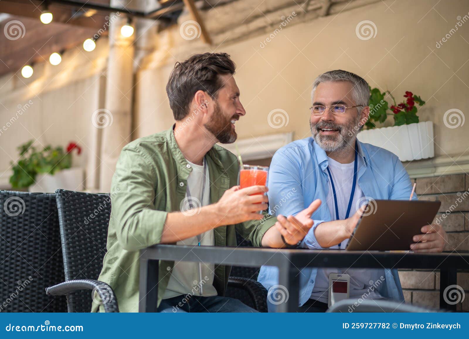 Two Colleagues Having Dinner and Looking Contented Stock Photo - Image ...
