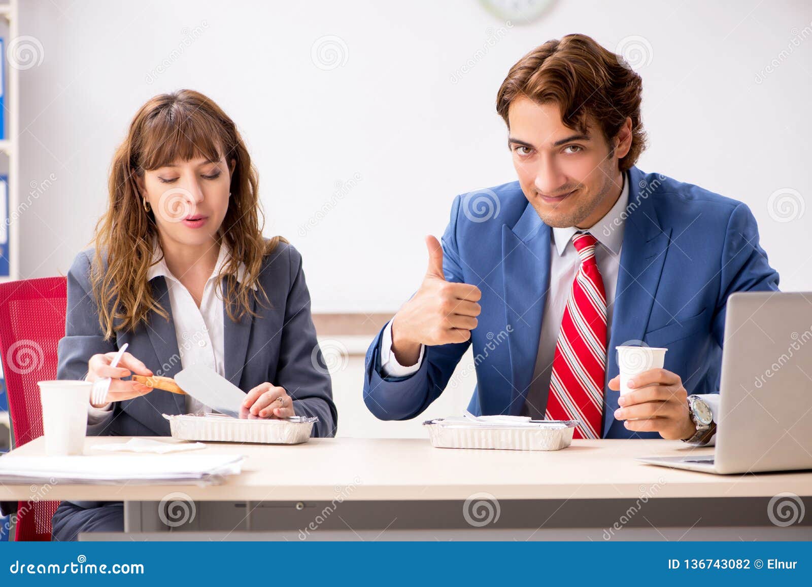 The Two Colleagues Having Lunch Break at Workplace Stock Photo - Image ...