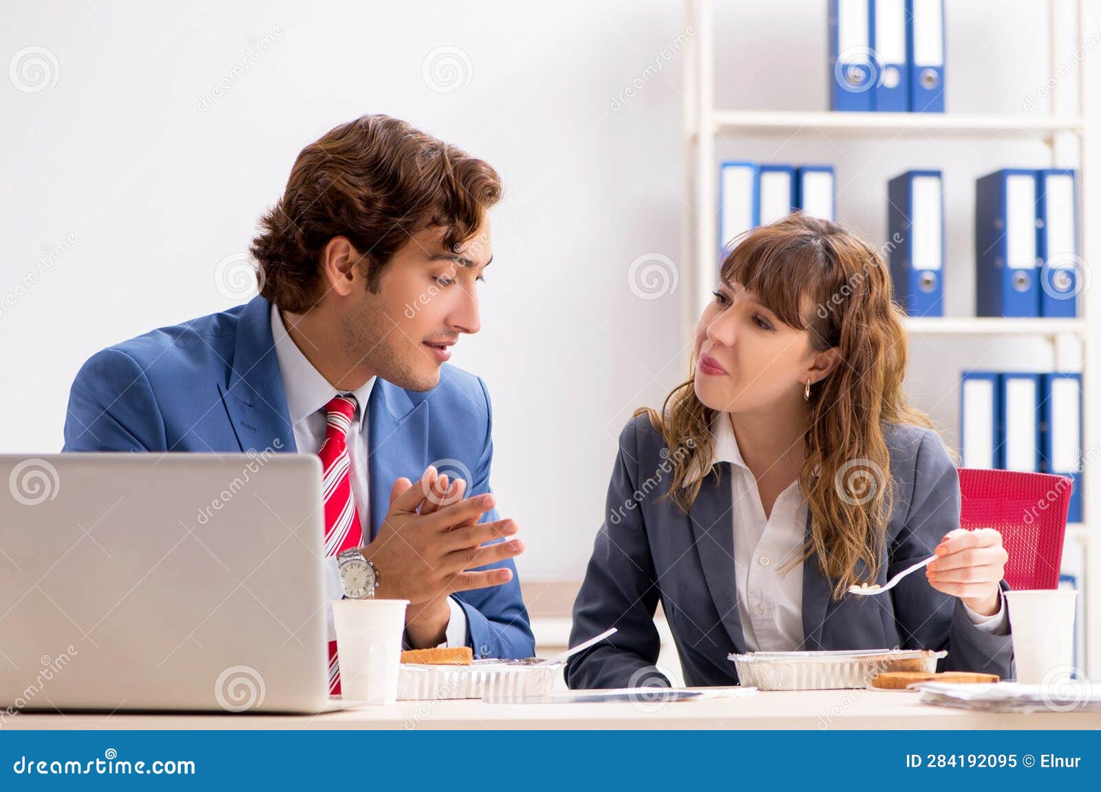 Two Colleagues Having Lunch Break at Workplace Stock Image - Image of ...