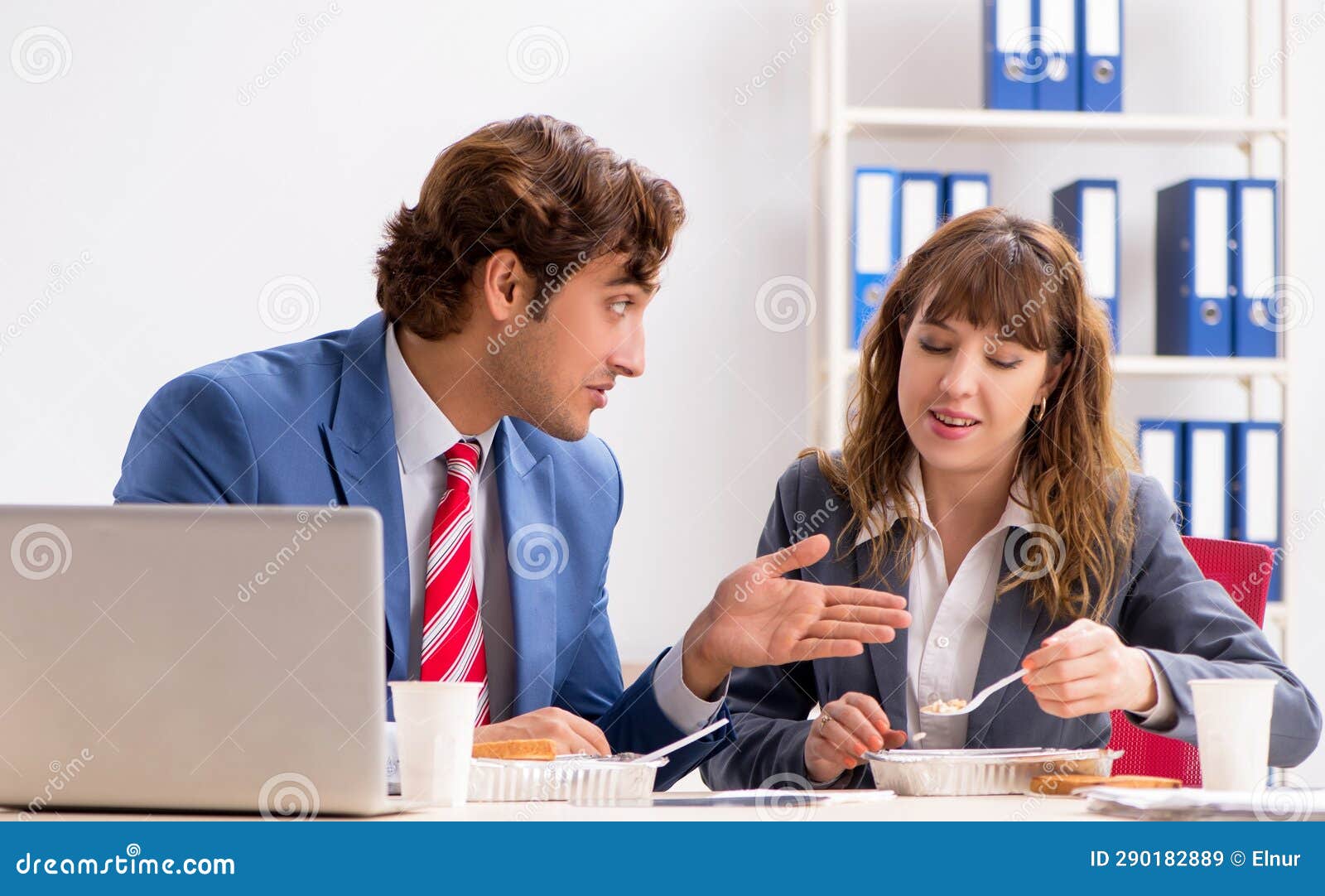Two Colleagues Having Lunch Break at Workplace Stock Image - Image of ...