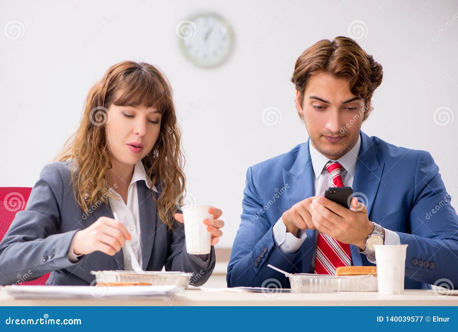 The Two Colleagues Having Lunch Break at Workplace Stock Image - Image ...