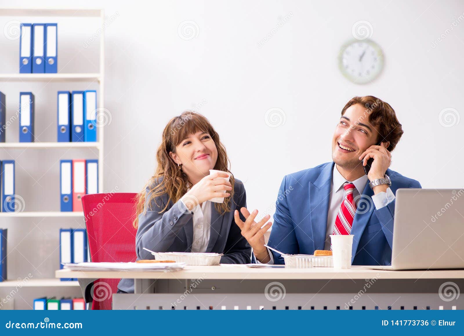 The Two Colleagues Having Lunch Break at Workplace Stock Photo - Image ...