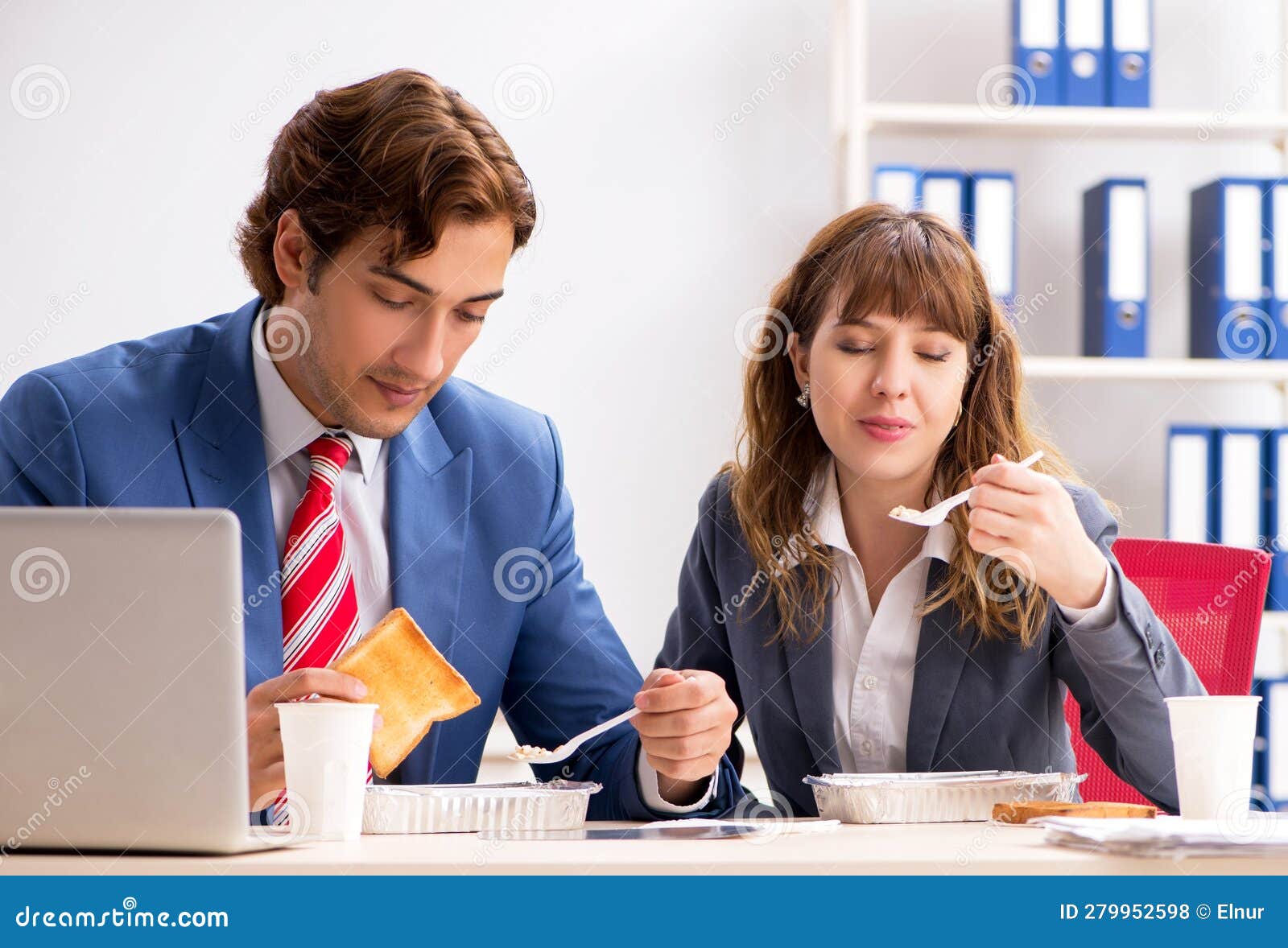 Two Colleagues Having Lunch Break at Workplace Stock Photo - Image of ...