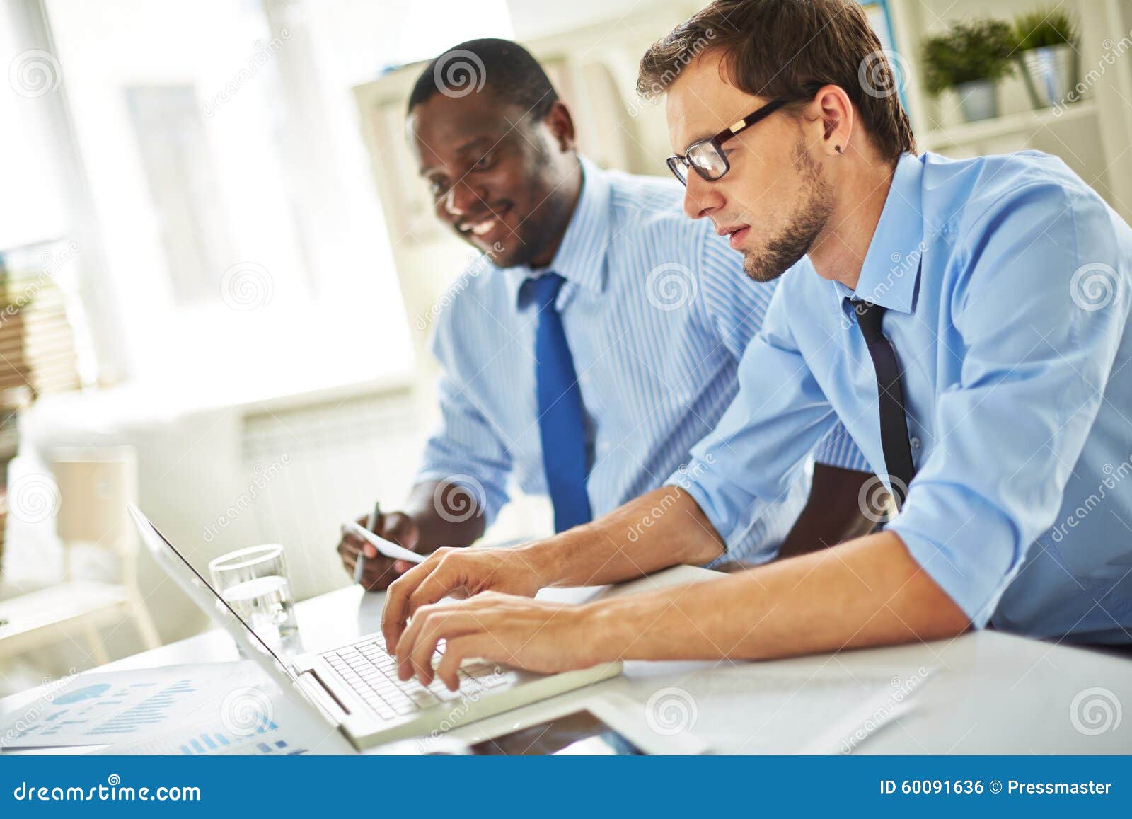 Two colleagues in office stock photo. Image of employee - 60091636