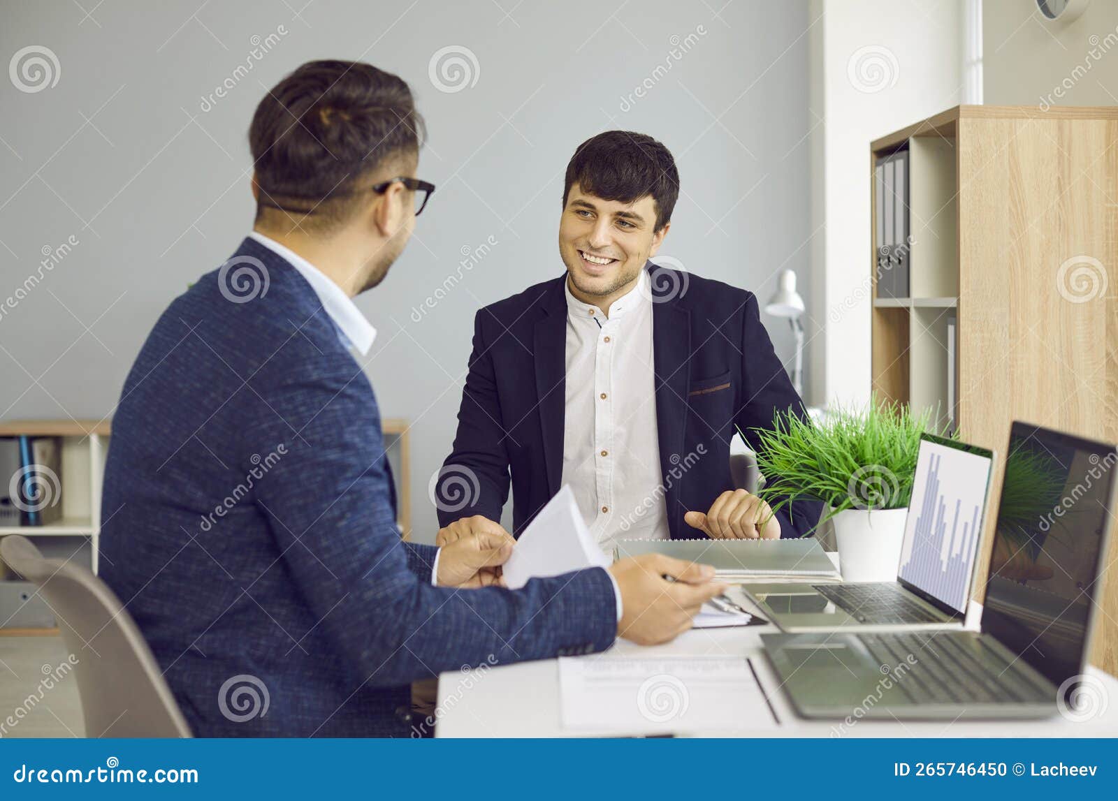 Two Colleagues in Office are Talking Discussing New Project or Task and ...