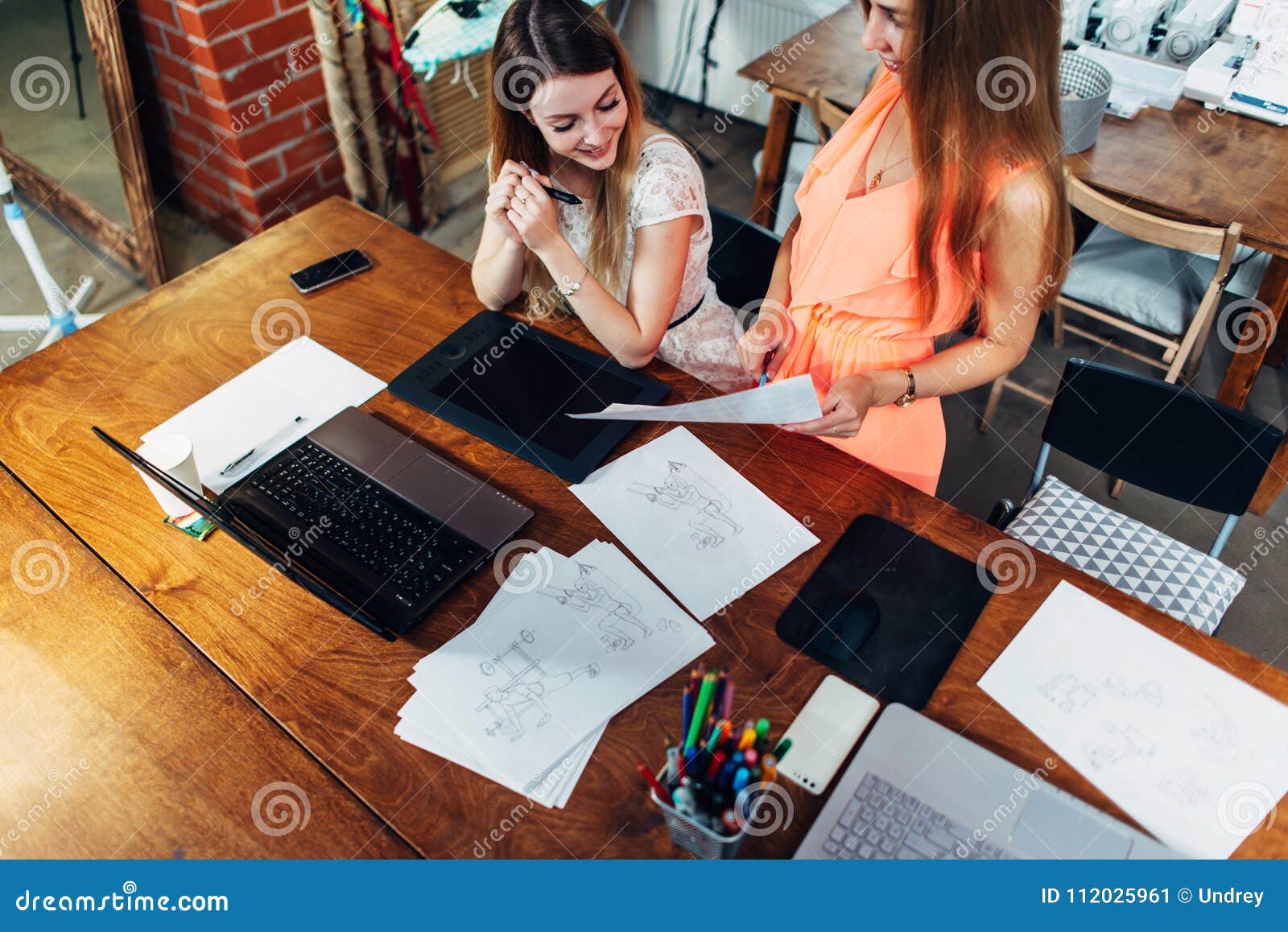 Two Colleagues Sharing Creative Ideas Discussing New Designs in Modern ...