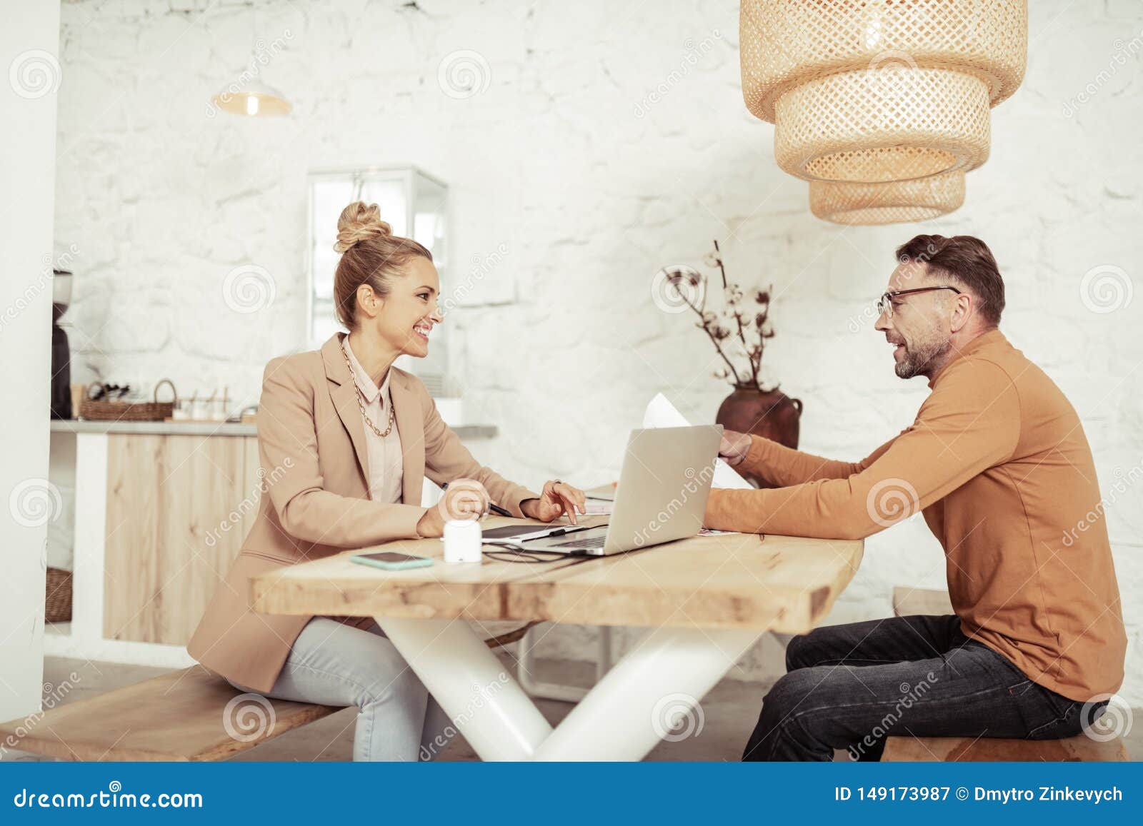 Two Colleagues Sitting Together at the Table. Stock Image - Image of ...