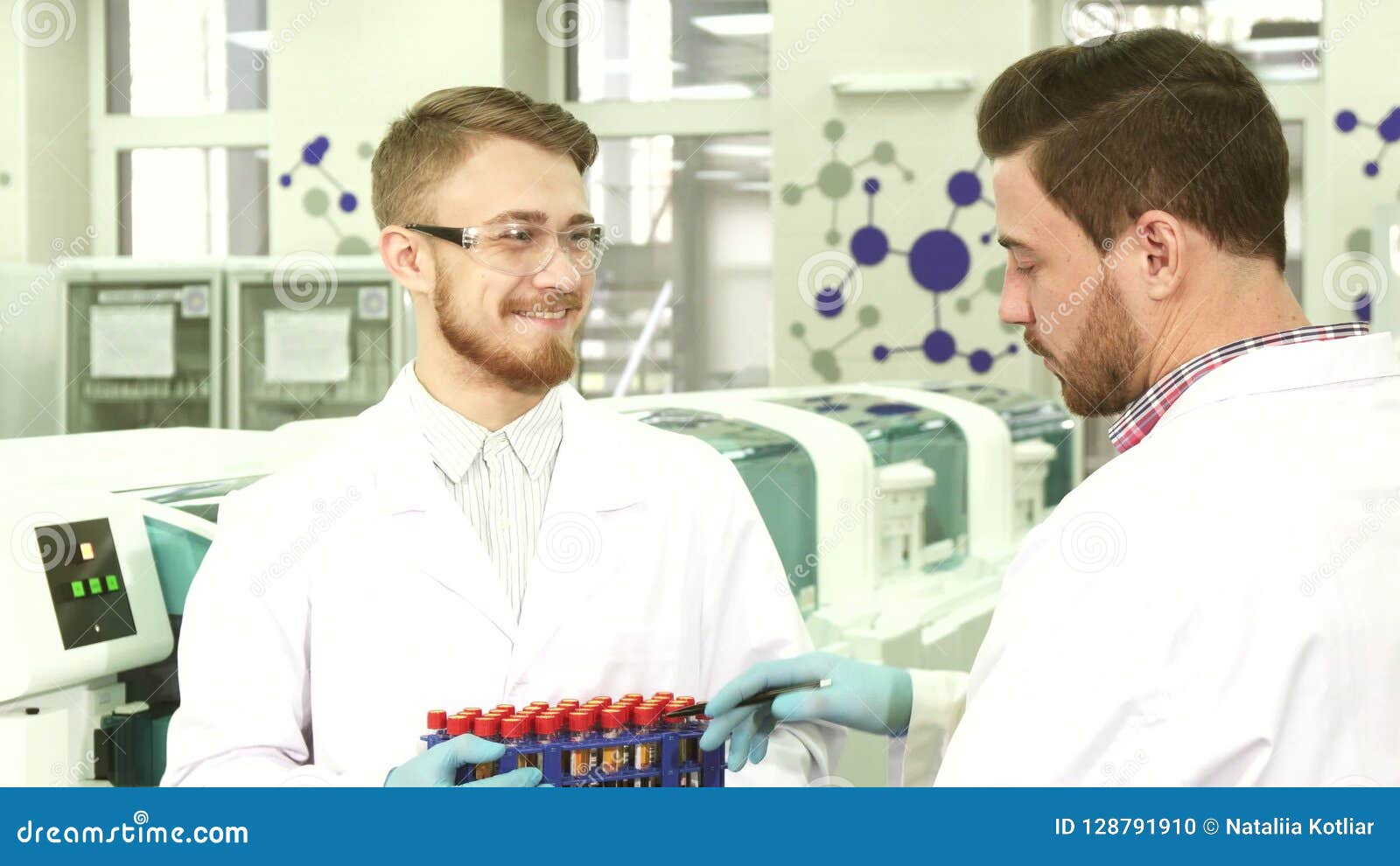 Colleagues in the Laboratory Discuss the Results of Their Activities ...