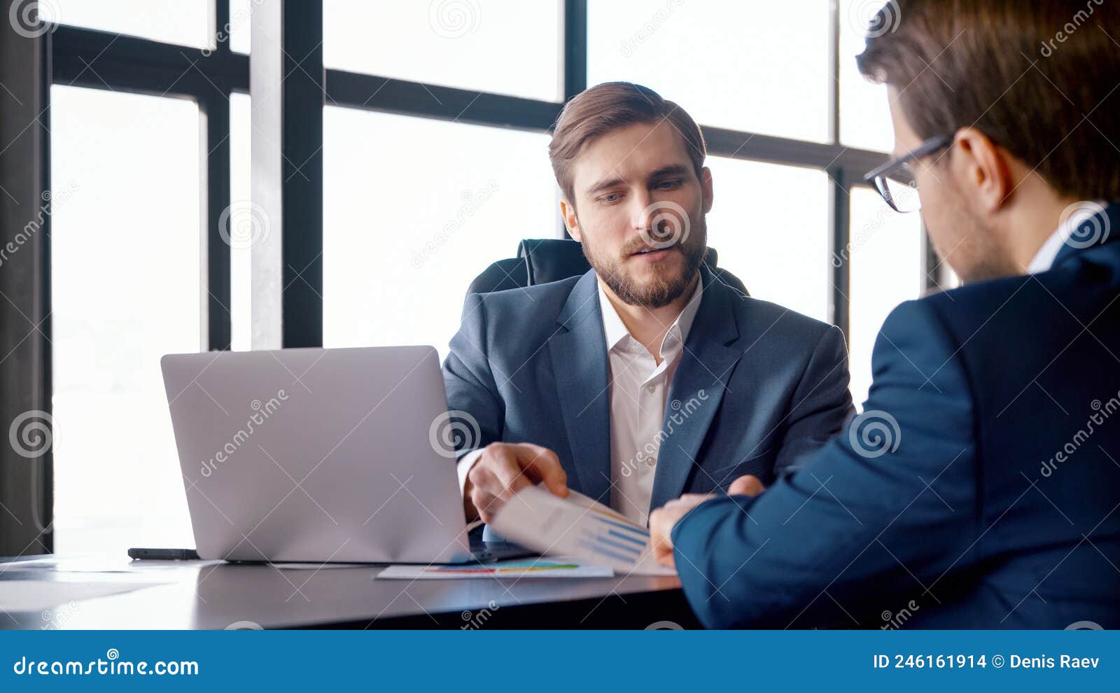 Two Colleagues in Suits Talking at the Desk Stock Photo - Image of team ...