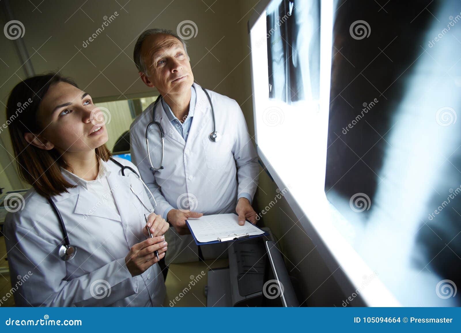 Analyzing x-ray stock photo. Image of pensive, physician - 105094664