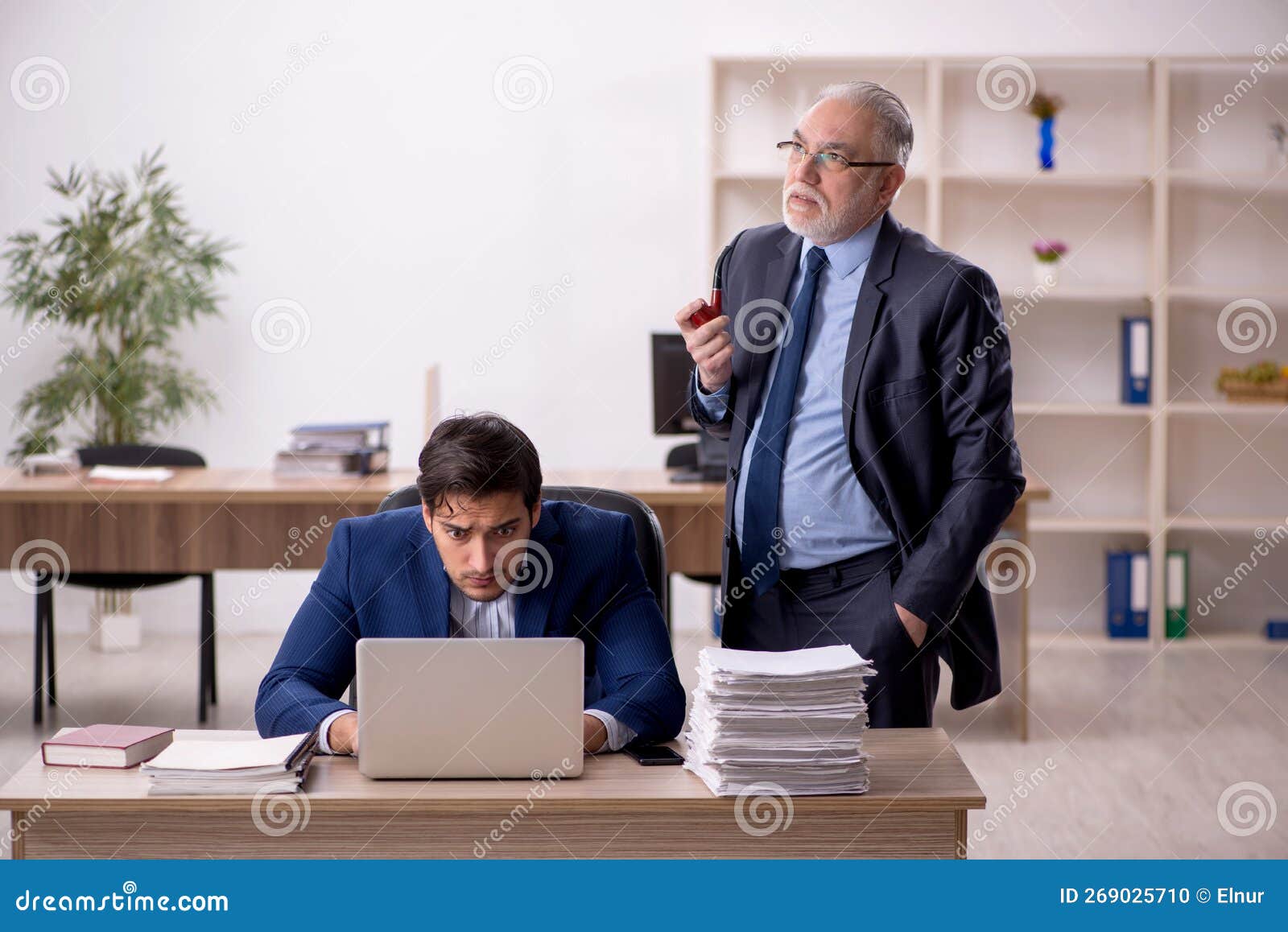 Two Male Colleagues Working in the Office Stock Photo - Image of pile ...