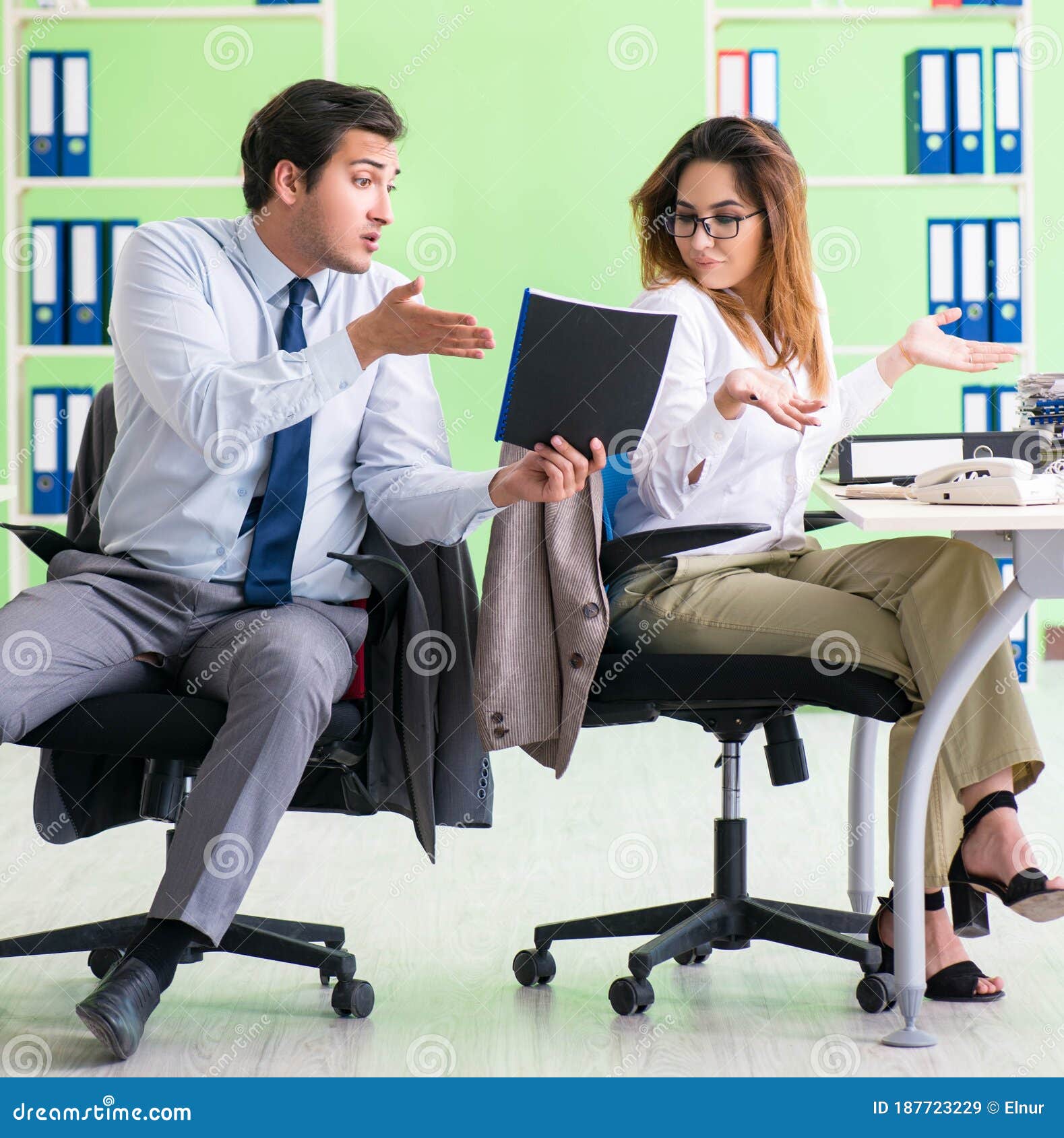 Two Colleagues Working in the Office Stock Image - Image of papers ...
