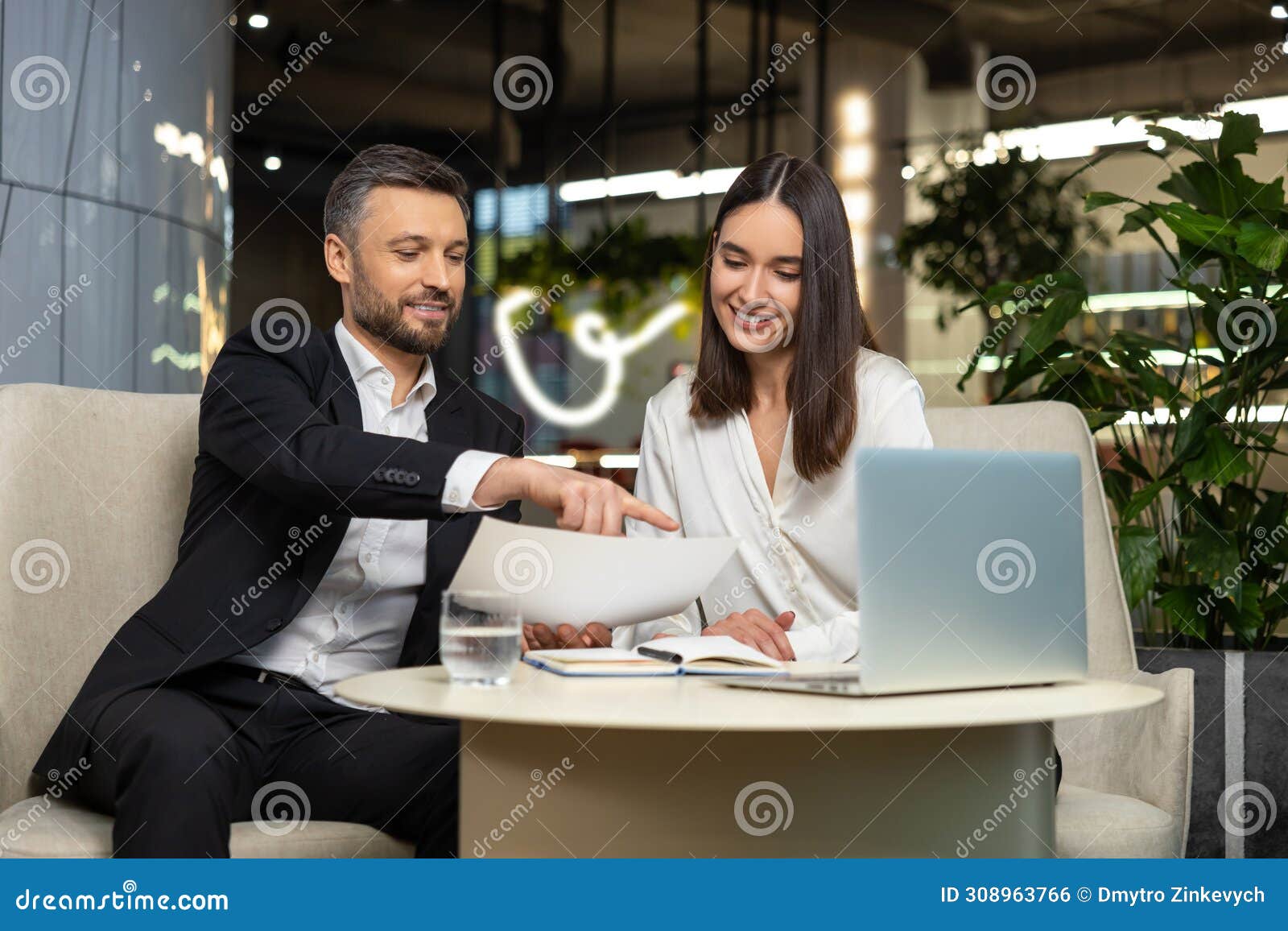 Two Colleagues Working on Project Together and Looking Involved Stock ...