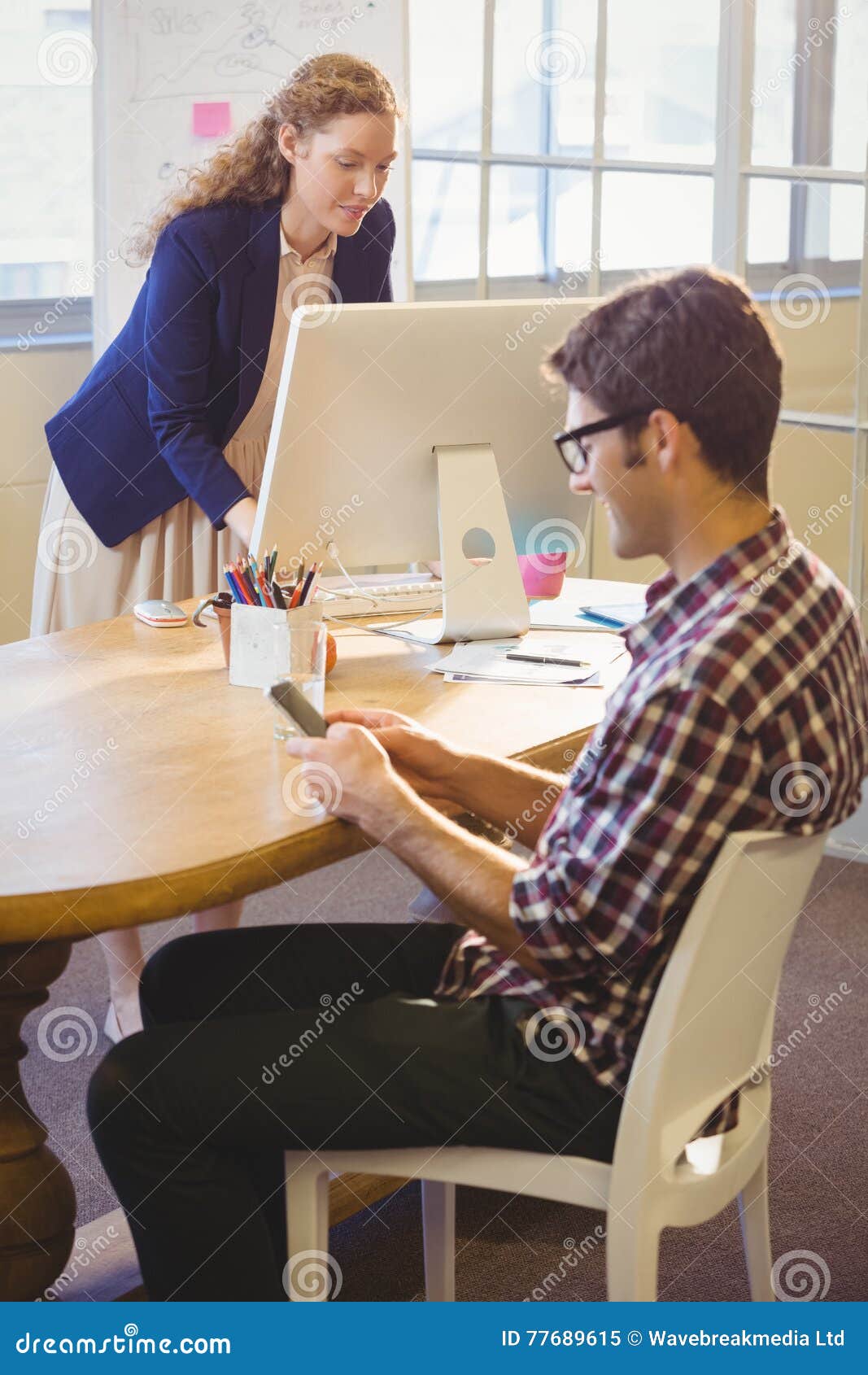 Two Colleagues Working in the Same Office Stock Image - Image of ...