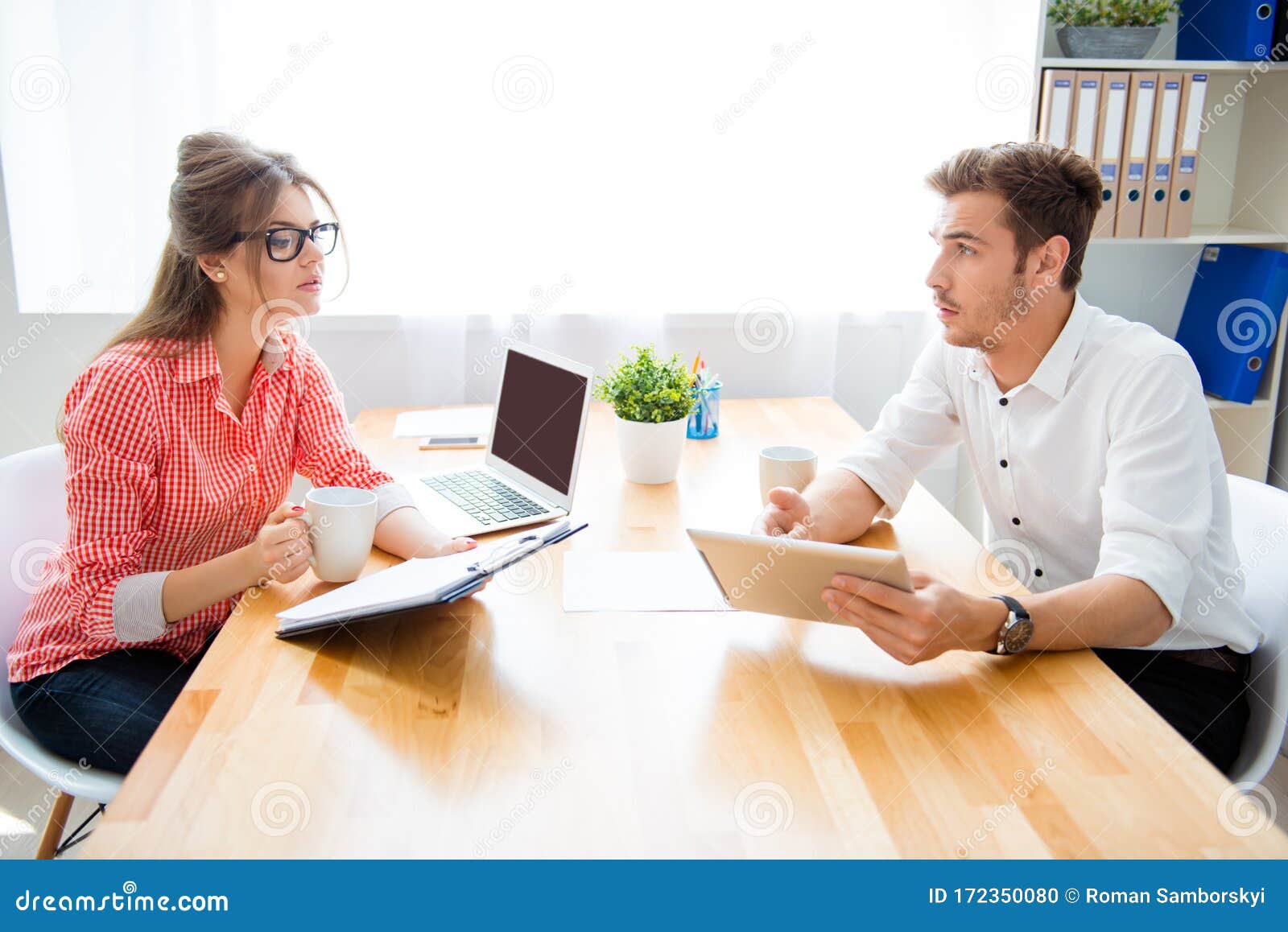 Two Colleagues Working Together at Businnes Project and Talking Stock ... Two Colleagues Working Together at Businnes Project and Talking Stock ...