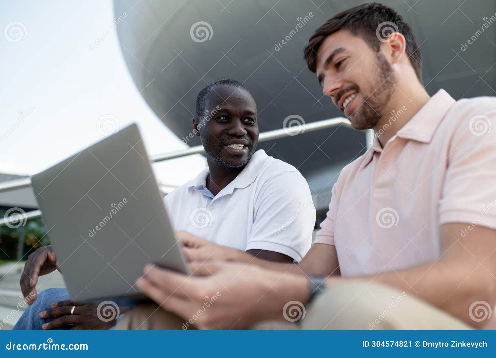 Two Colleagues Working Together Remotely and Looking Involved Stock ...