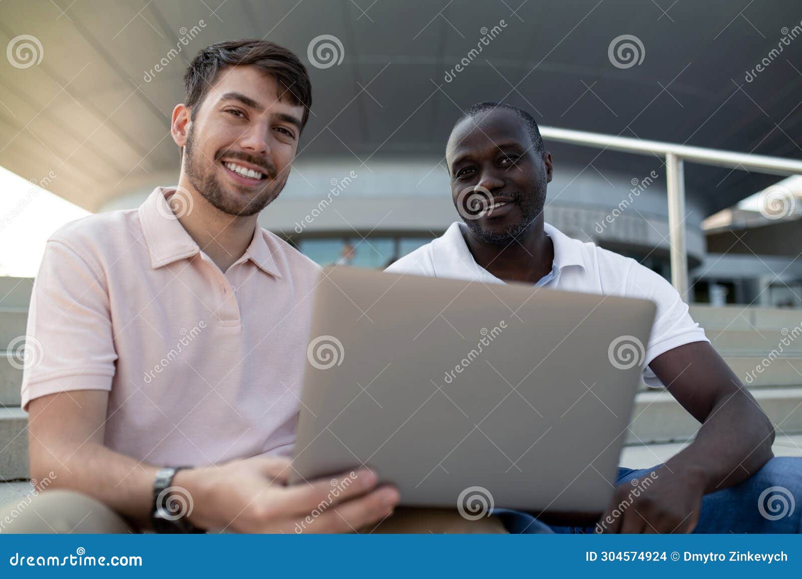 Two Colleagues Working Together Remotely and Looking Involved Stock ...