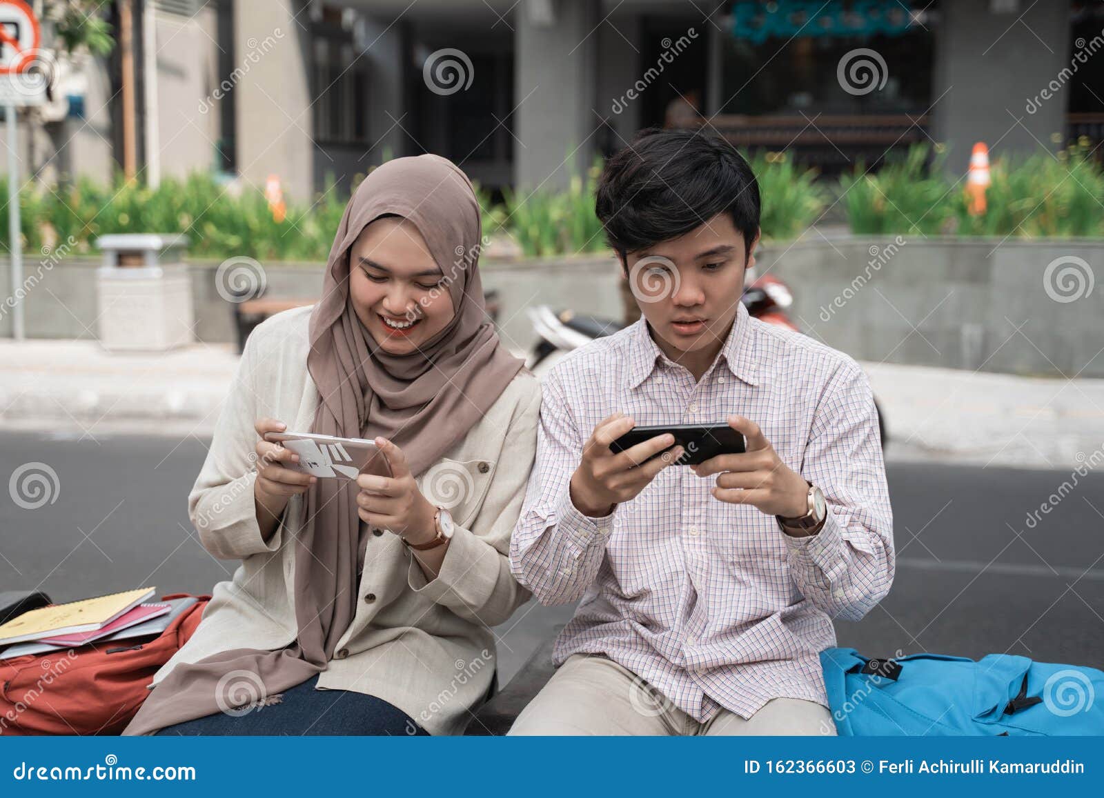 Two College Student Enjoy the Game Using Smartphone Stock Image - Image ...