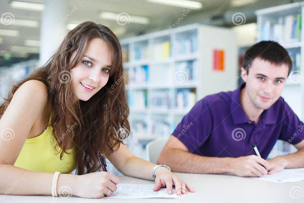 Two College Students in Library Stock Photo - Image of choosing ...