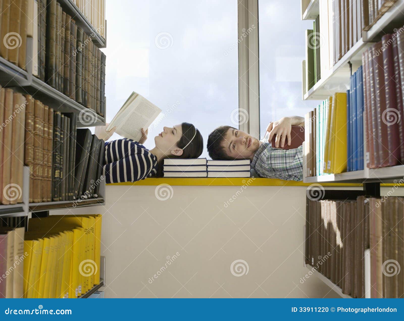 Two College Students Reading in Library Stock Photo - Image of adult ...