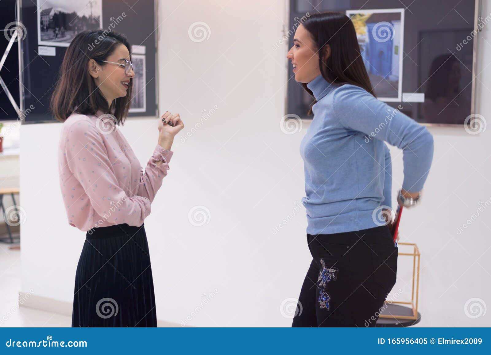 Two College Students Standing in Corridor and Chatting after Their ...