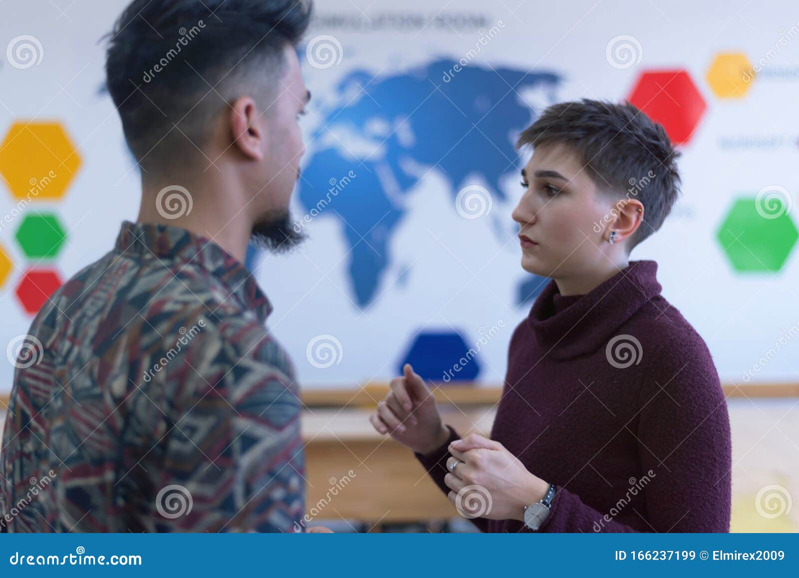 Two College Students Standing Inside Classroom and Chatting after Their ...