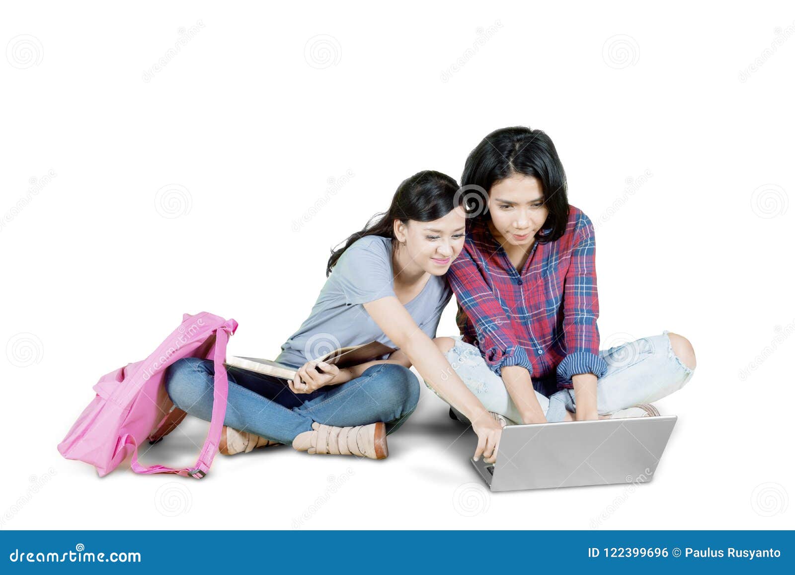 Two College Students Using A Laptop On Studio Stock Photo - Image of ...