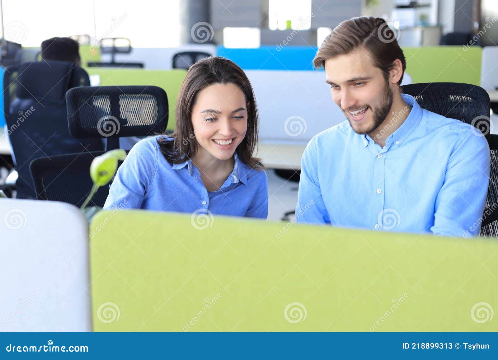 Two Collegues Discussing Documents and Other Working Moments in Office ...