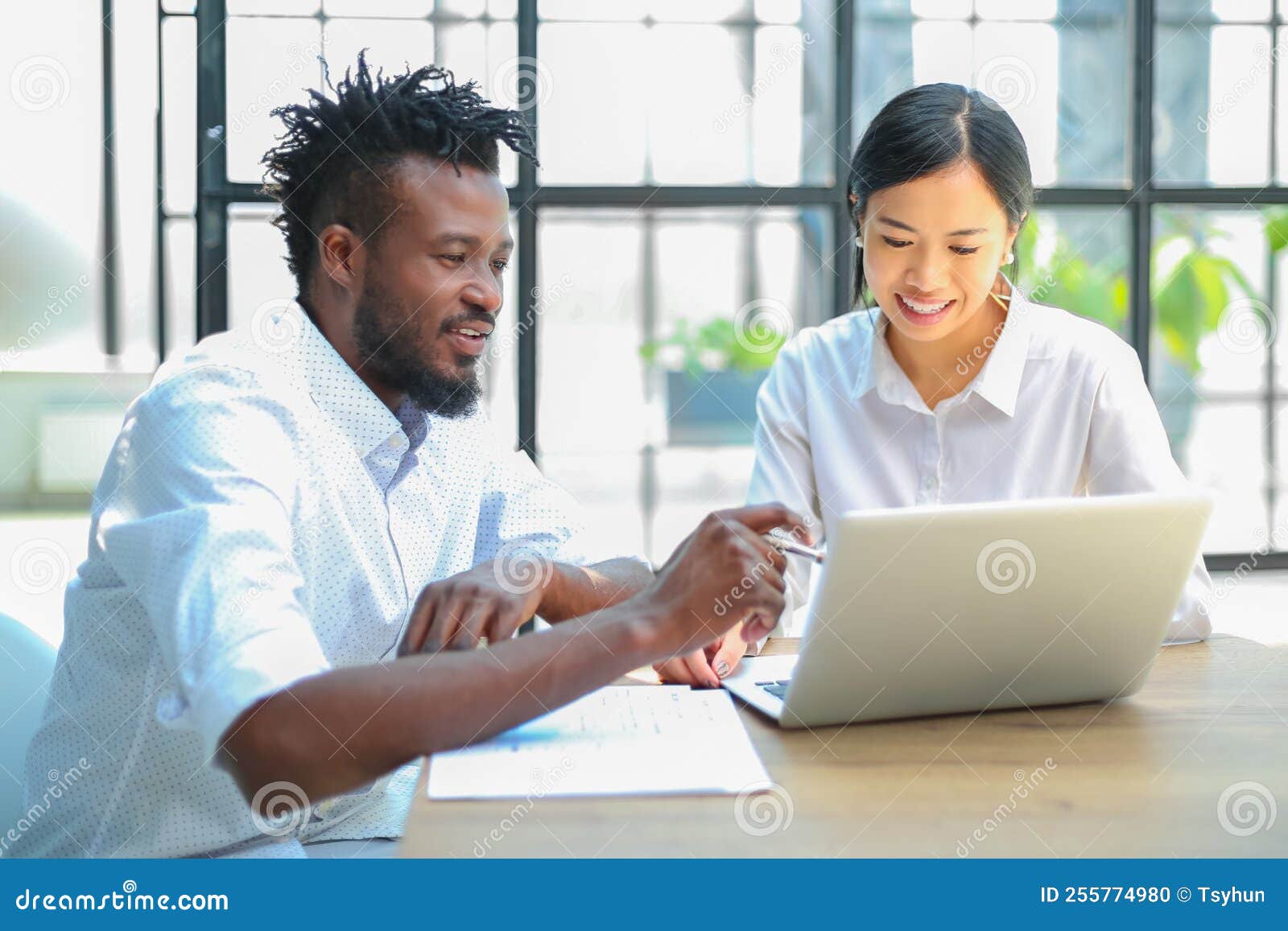 Two Collegues Discussing Documents and Other Working Moments in Office ...