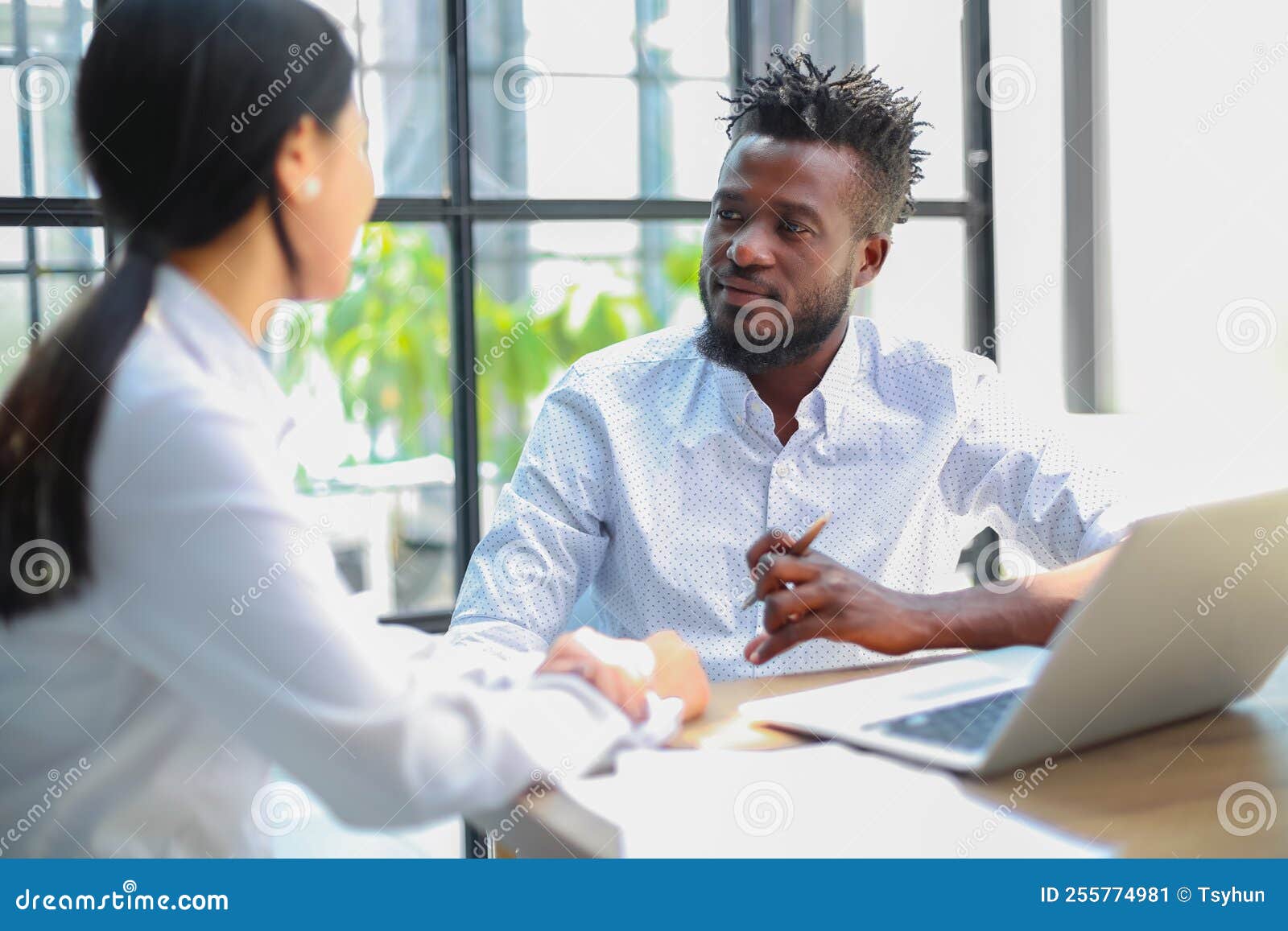 Two Collegues Discussing Documents and Other Working Moments in Office ...