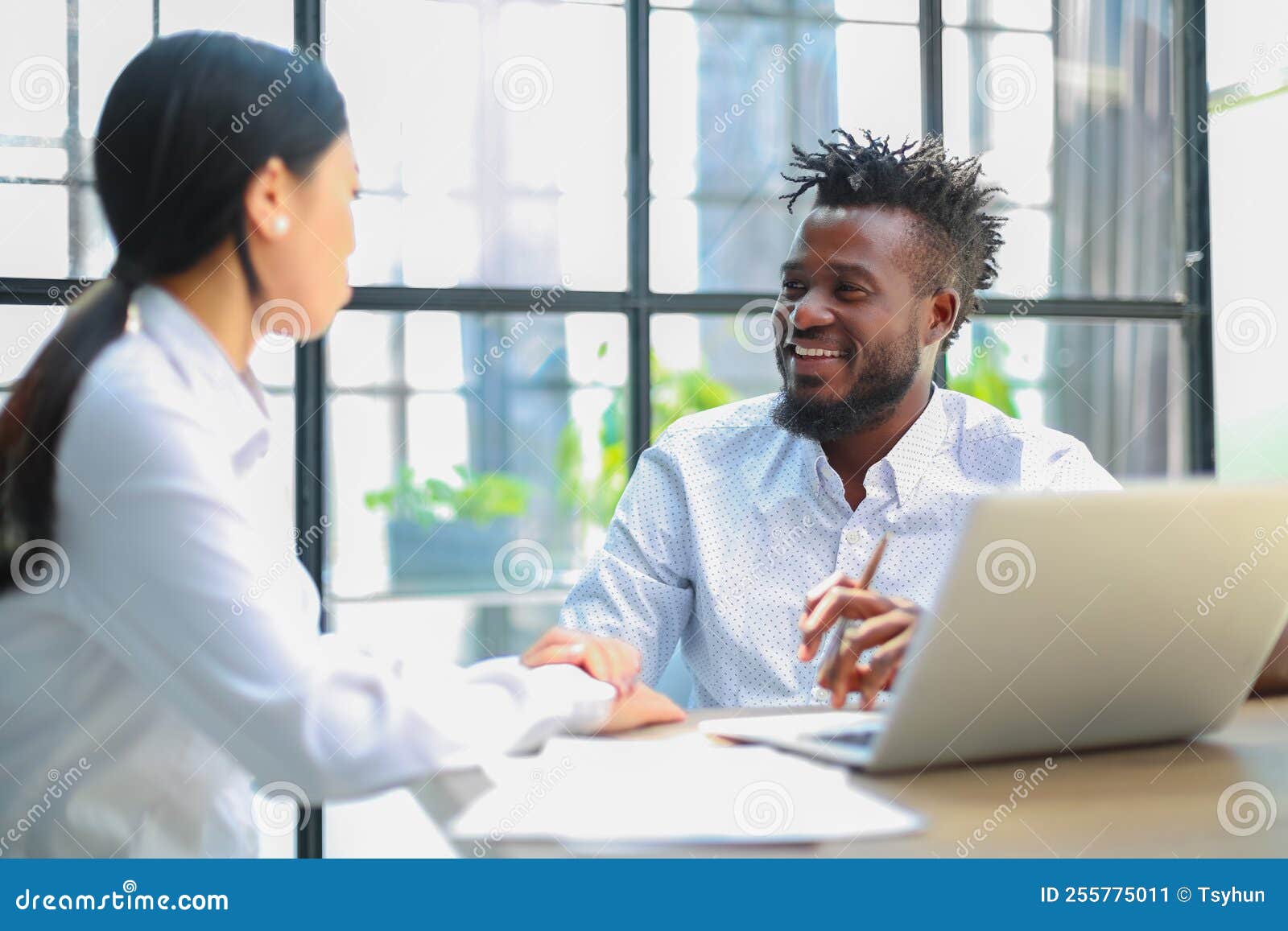 Two Collegues Discussing Documents and Other Working Moments in Office ...
