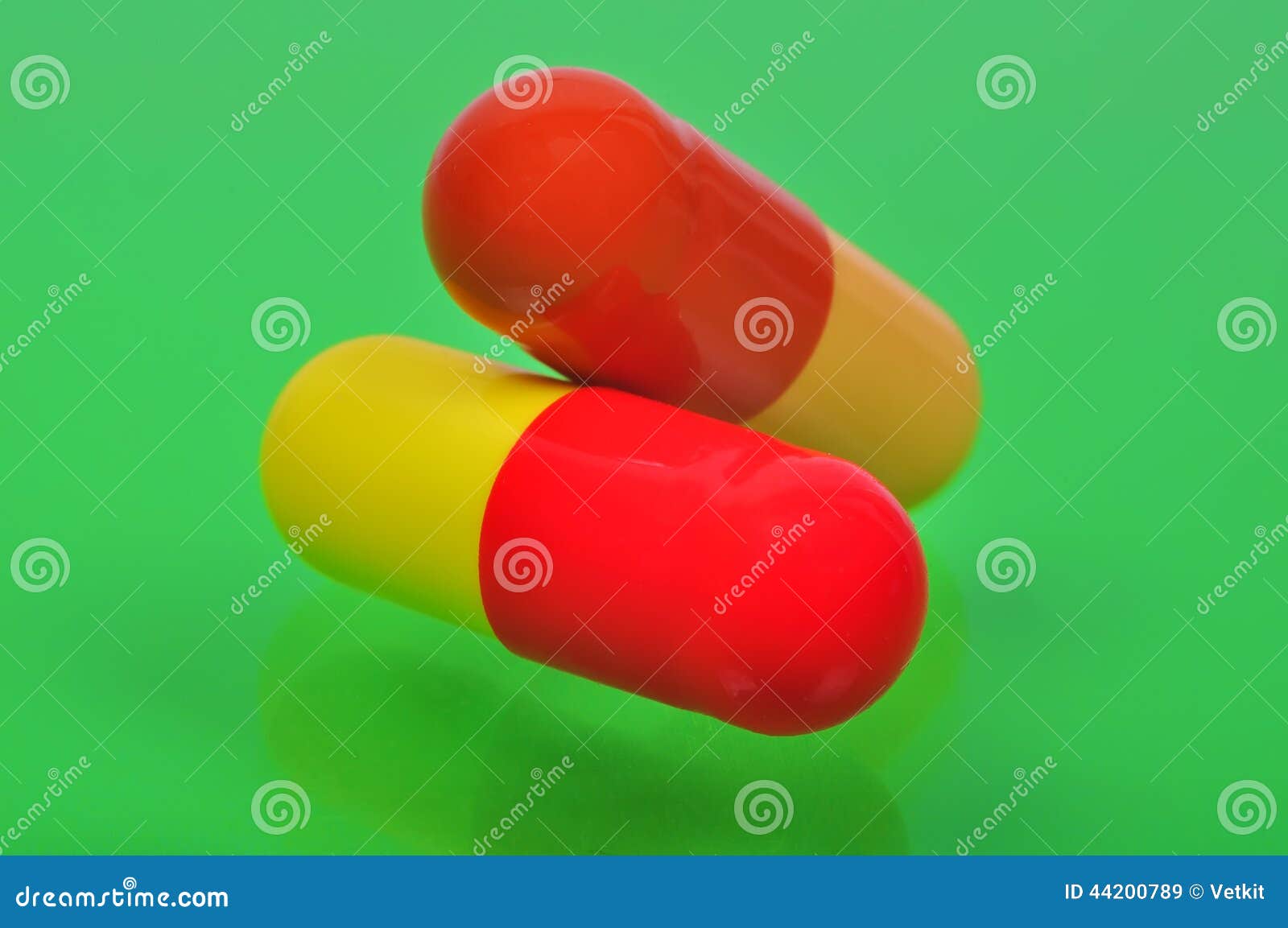 Two colorful capsules stock image. Image of medicine - 44200789