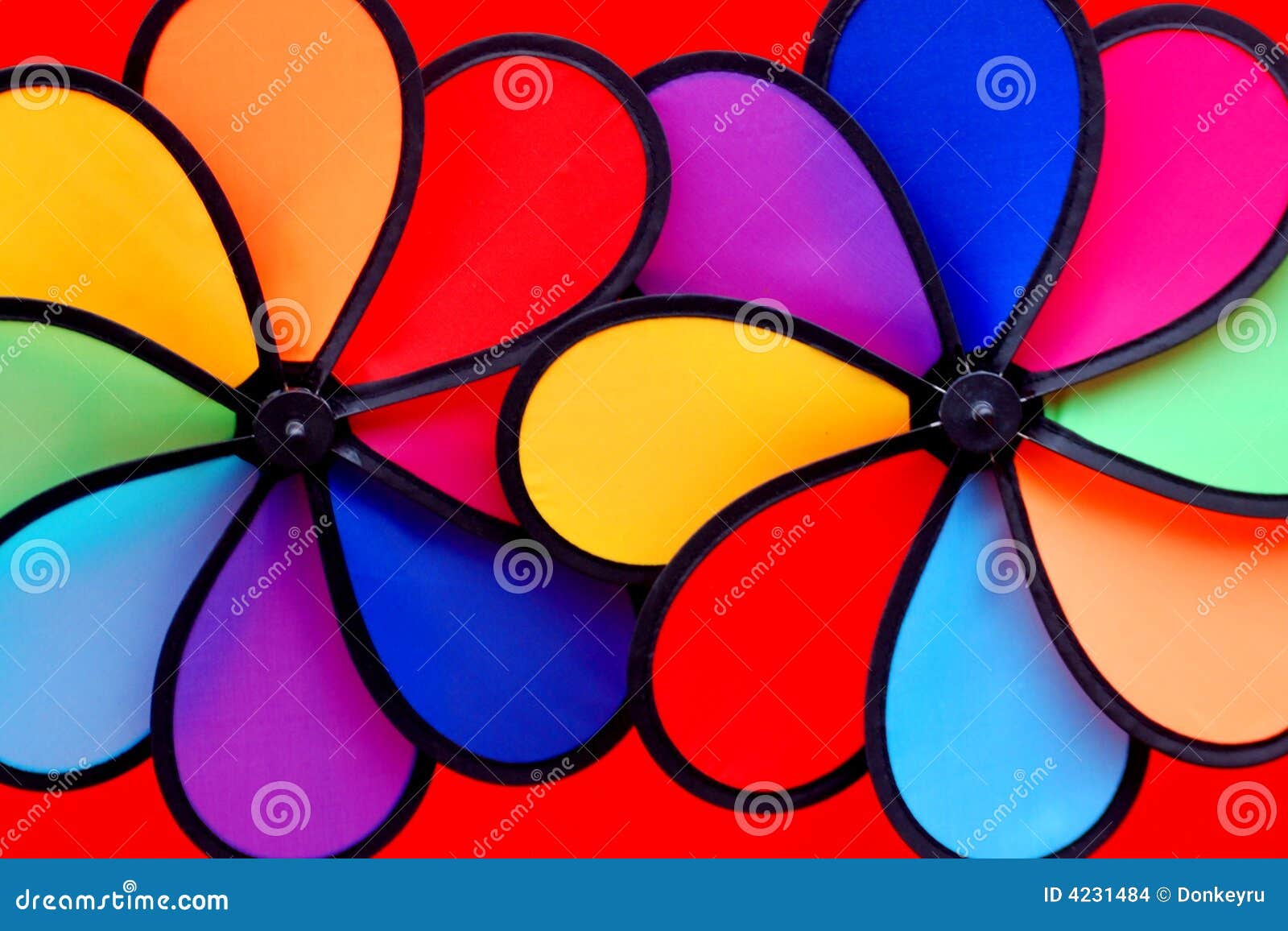 Two colorful pinwheels stock photo. Image of navy, purple - 4231484