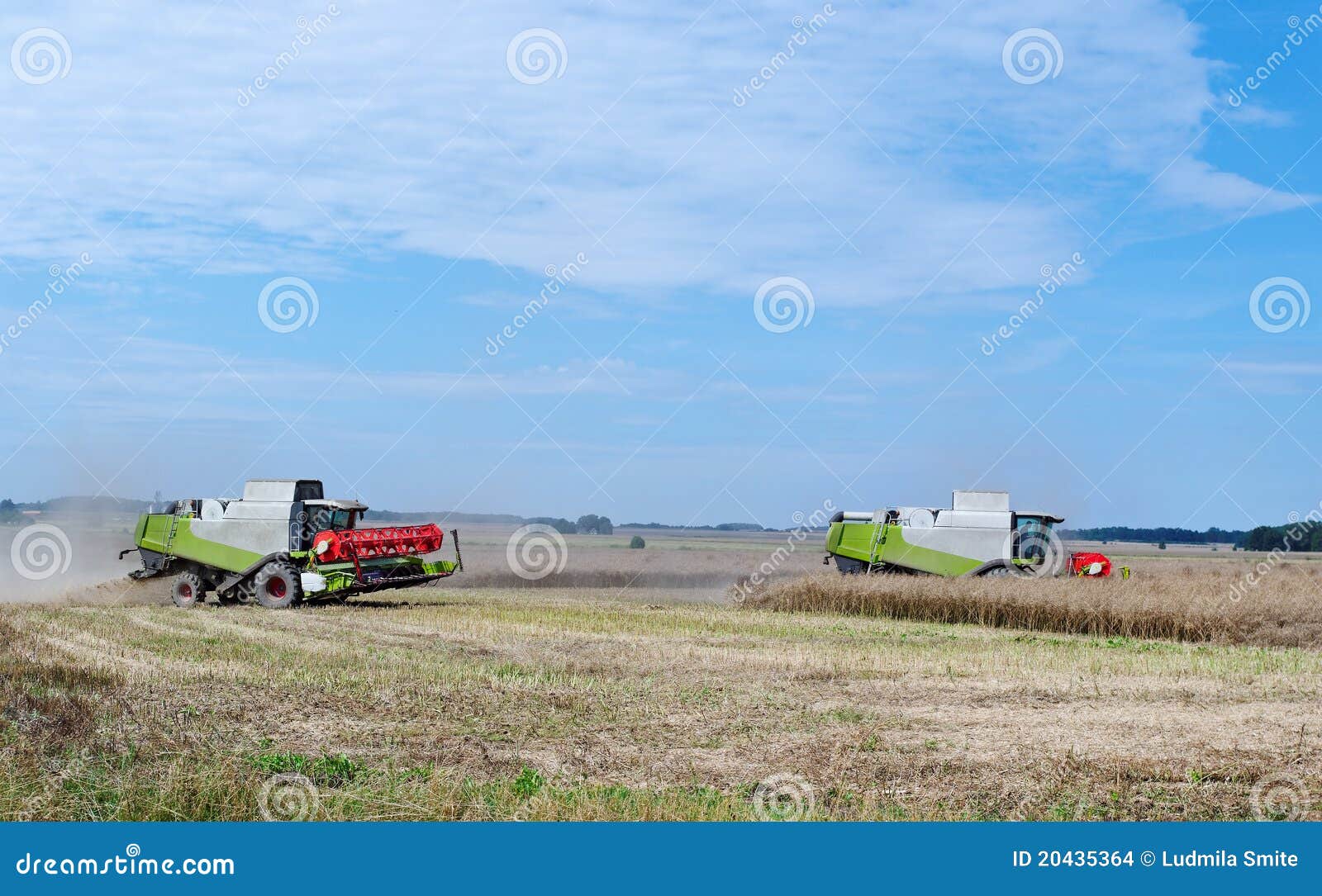 Two combines on the field. stock photo. Image of landscape - 20435364