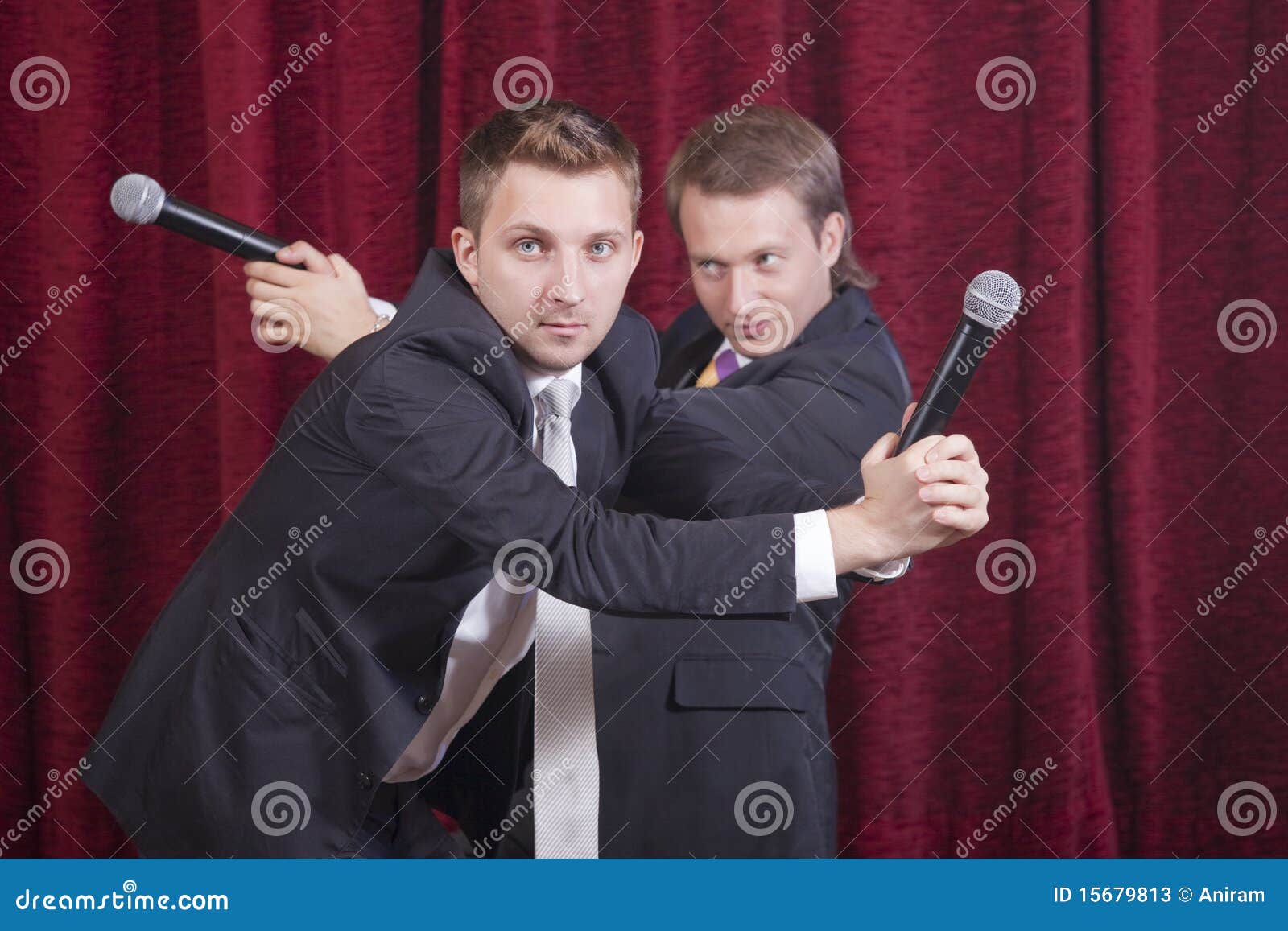 Two Comedians with Microphones Stock Image - Image of show, holding ...