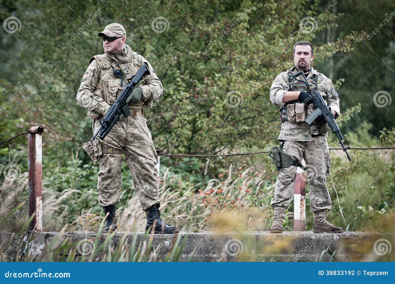 Two Commandos Patrolling, on the Bridge Stock Photo - Image of ammo ...