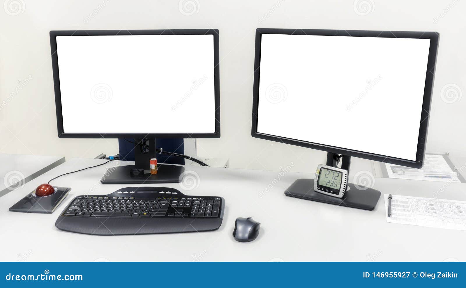 Two Computer Monitors are on the Table in the Office. on the Monitors ...