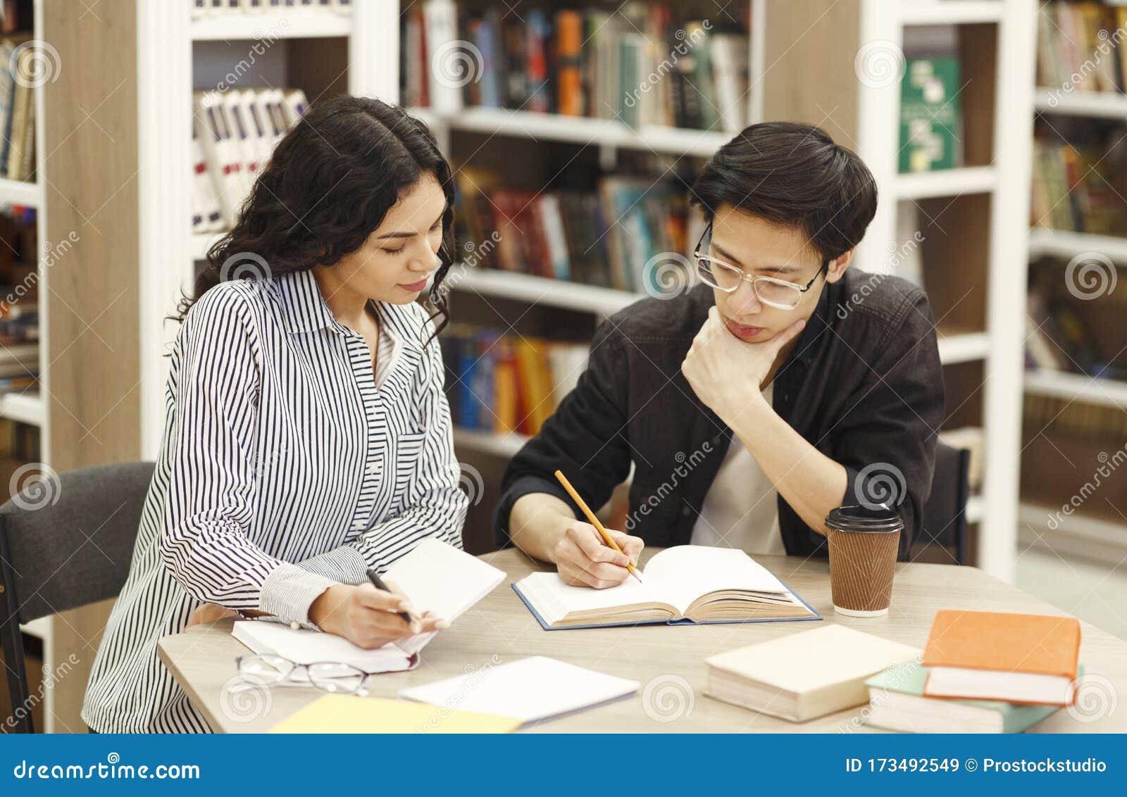 Two Concentrated Multiracial Students Learning at Library Stock Image ...