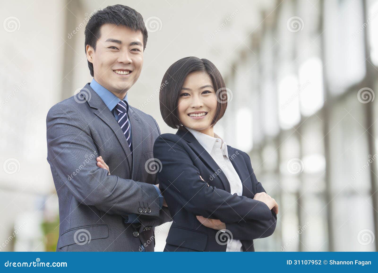 Two Confident Business People with Arms Crossed Looking at Camera Stock ...