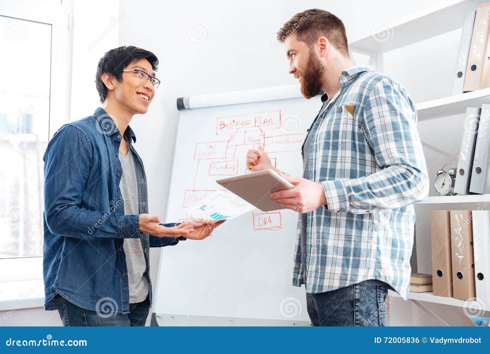 Two Confident Businessmen Making Business Plan Using Tablet and ...