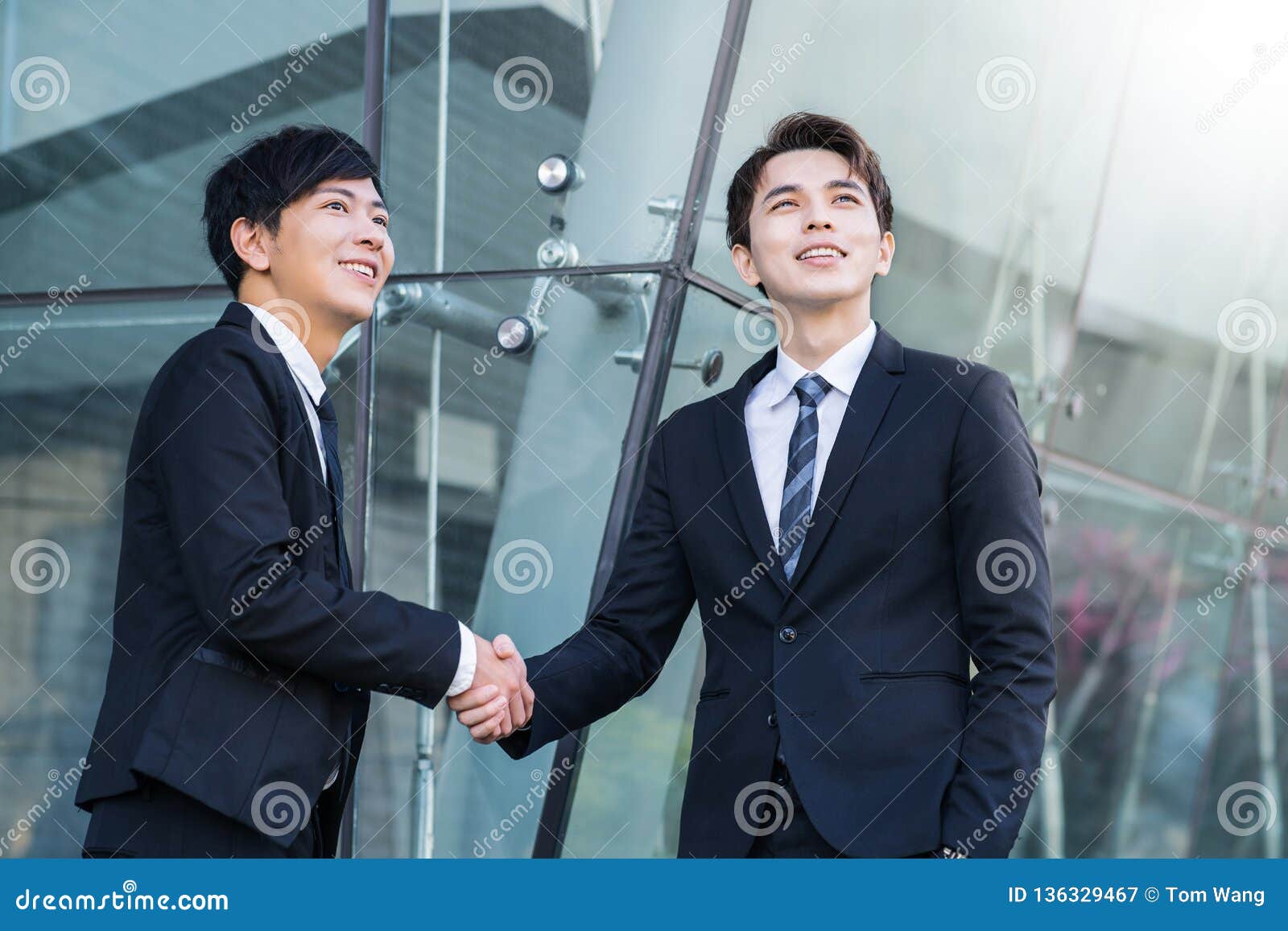 Confident Businessmen Shaking Hands and Smiling Stock Image - Image of ...