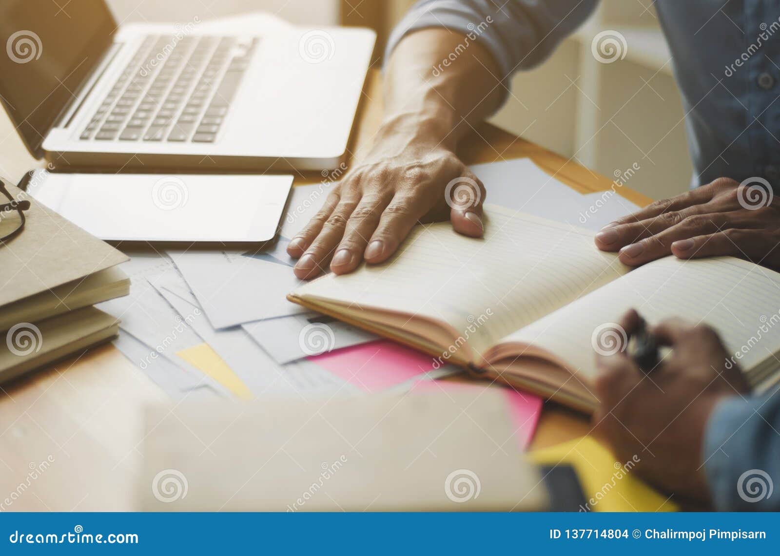 Two Confident Students Doing Homework Together while Sitting at the ...